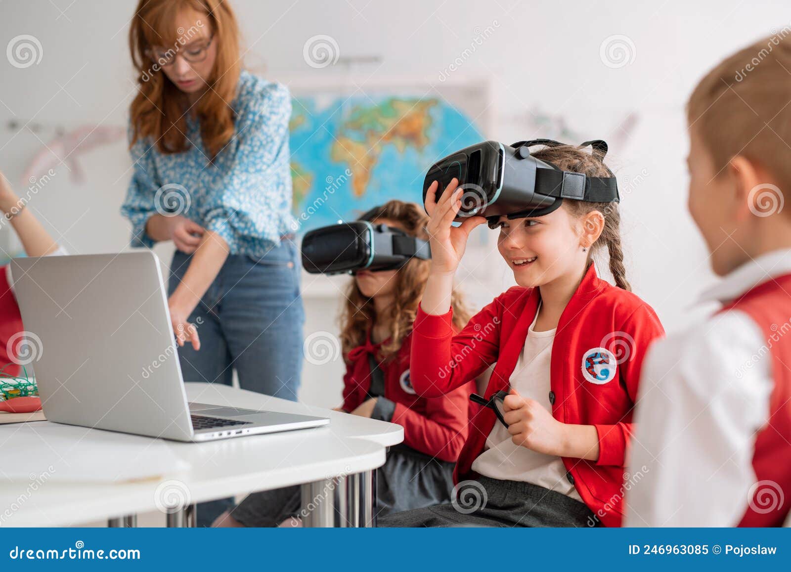 Happy Schoolchildren Wearing Virtual Reality Goggles at School in ...