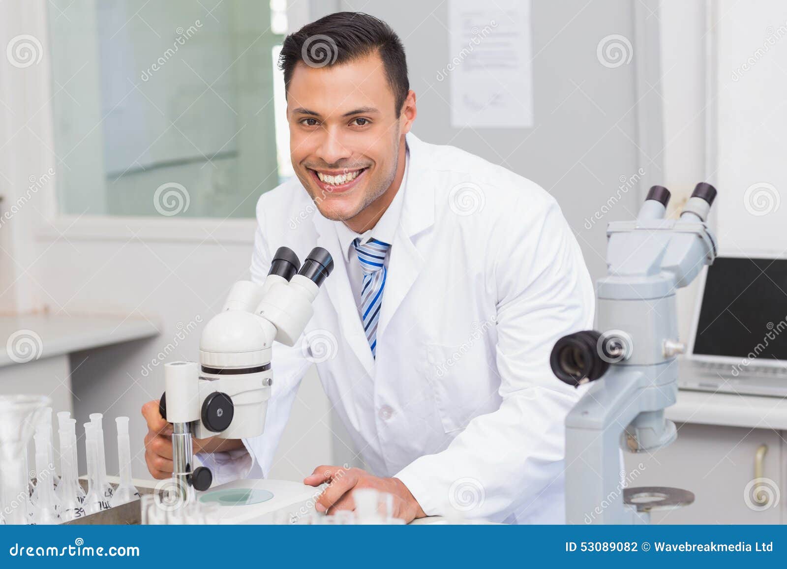Happy Scientist Using Microscope Stock Photo - Image of adult ...