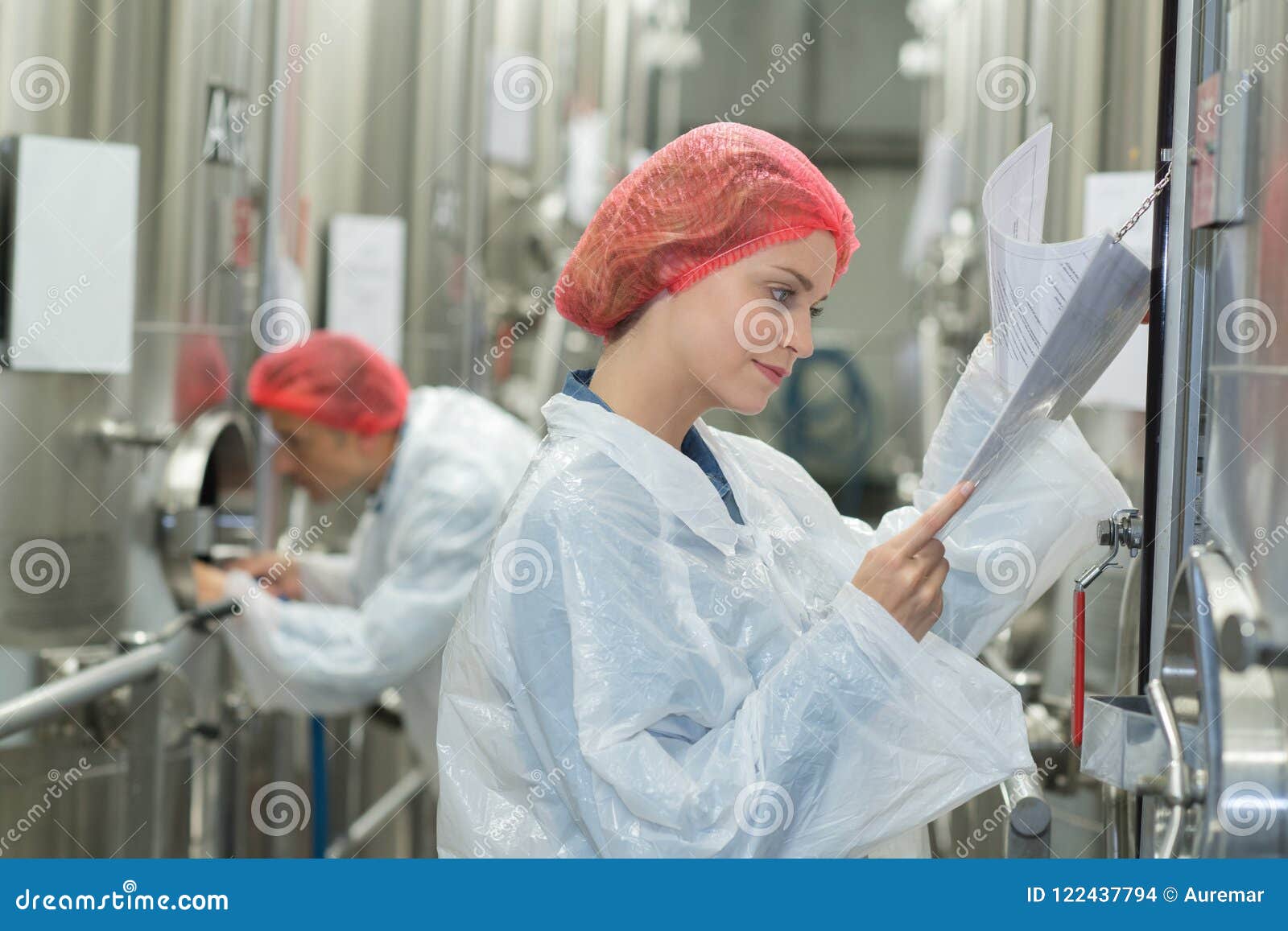 Happy Scientists Posing Checking Paperwork in Factory Stock Photo ...