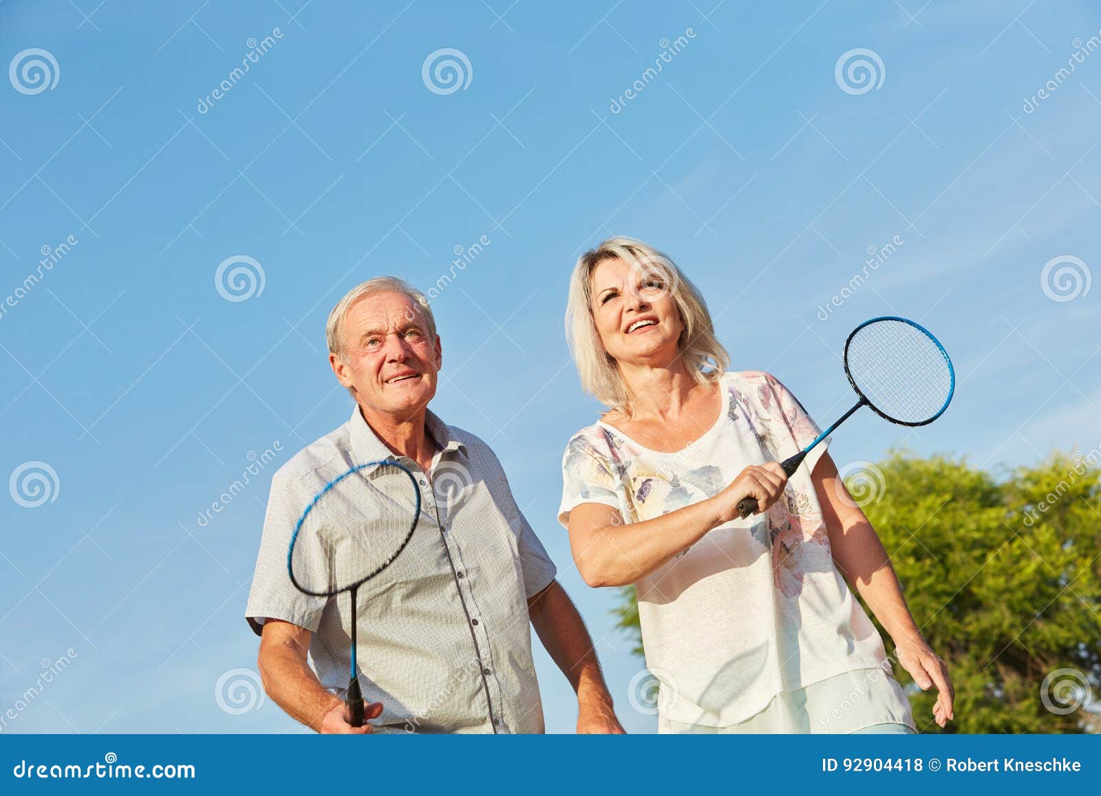 Happy Senior Citizens Playing Badminton Stock Photo - Image of ...