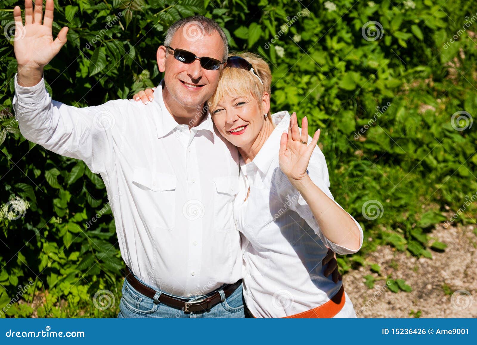 Happy Senior Couple Outdoors Waving Hands Stock Photo - Image of ...