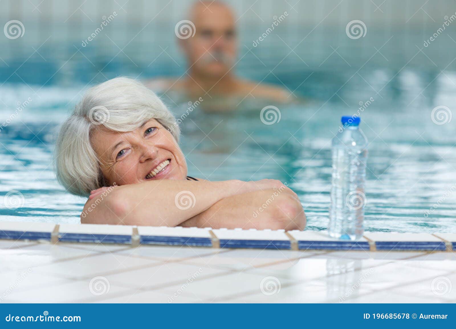 Happy Senior Couple in Swimming Pool Stock Photo - Image of routine ...