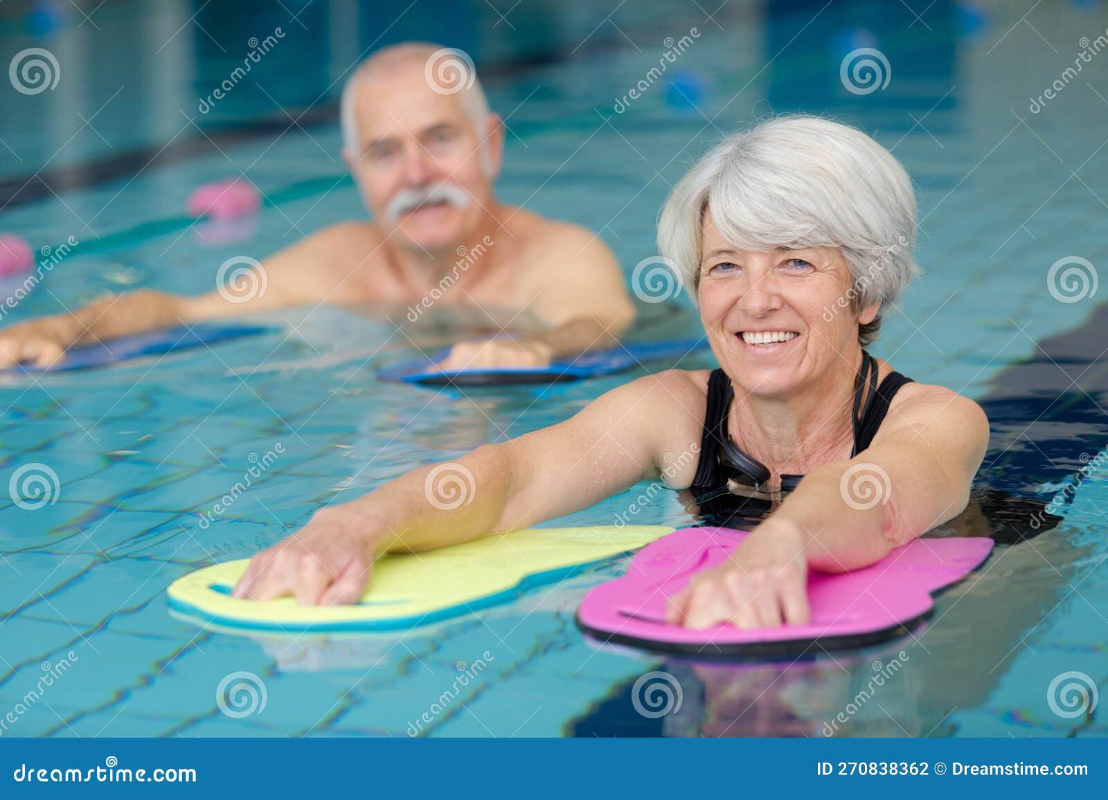 Happy Senior Couple Taking Swimming Lessons Stock Photo - Image of ...