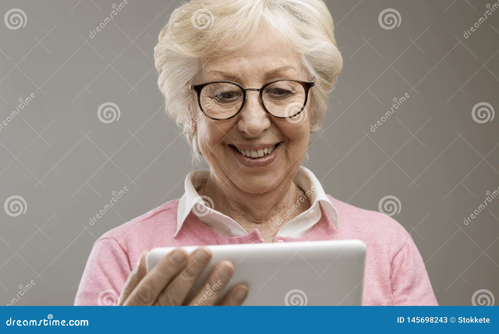 Happy Senior Lady Using a Digital Tablet Stock Image - Image of ...