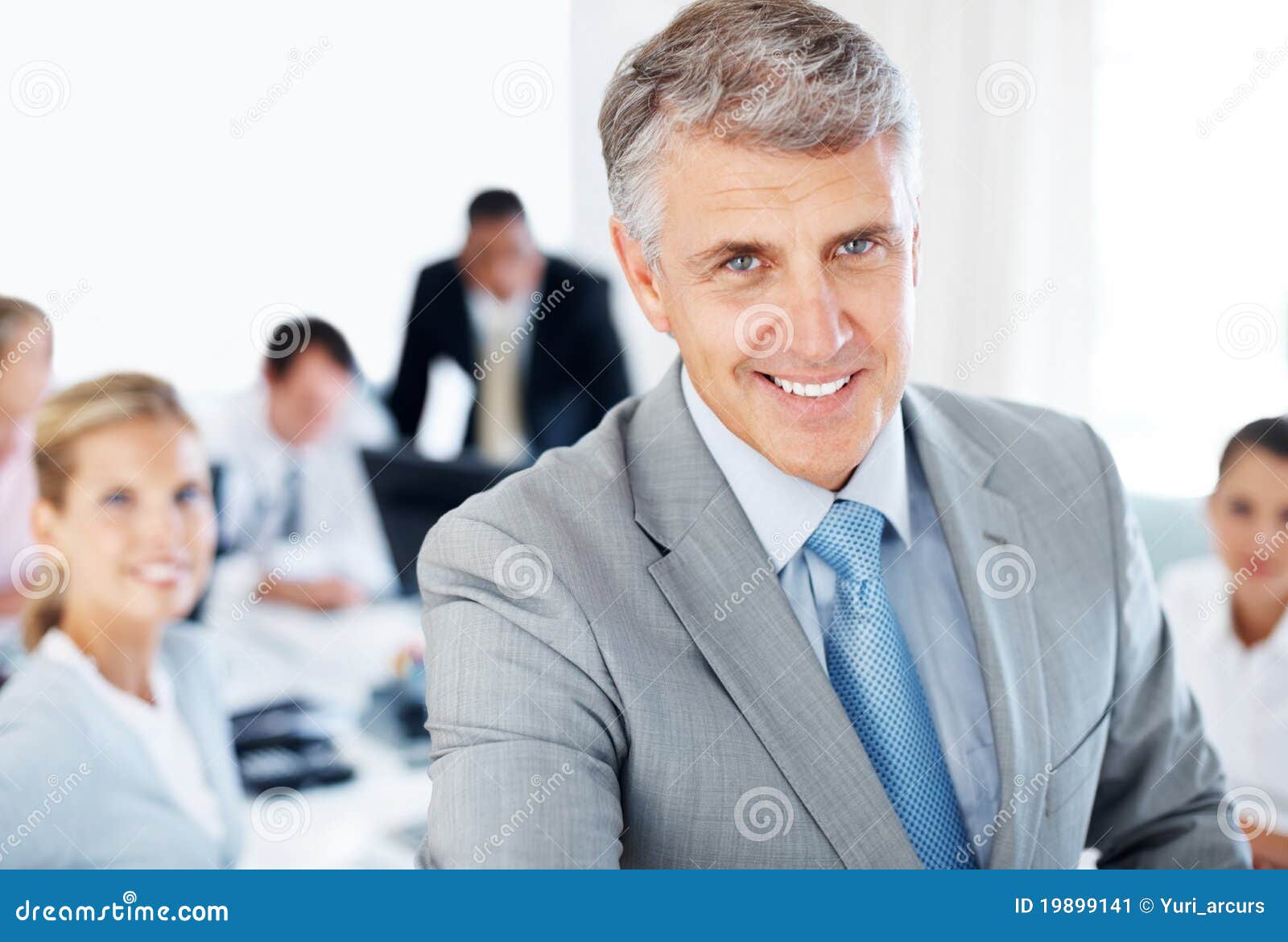 Happy Senior Manager Smiling with His Team Behind Stock Image - Image ...