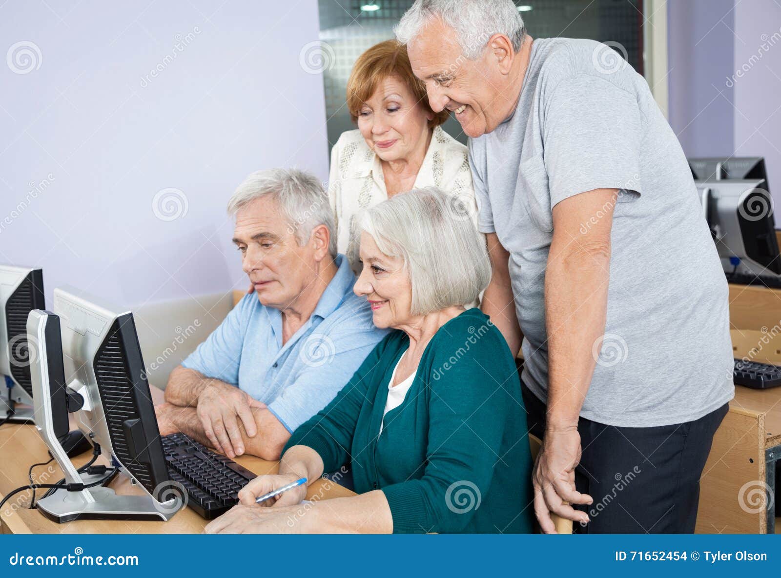 Happy Senior People Using Computer Together in Class Stock Photo ...