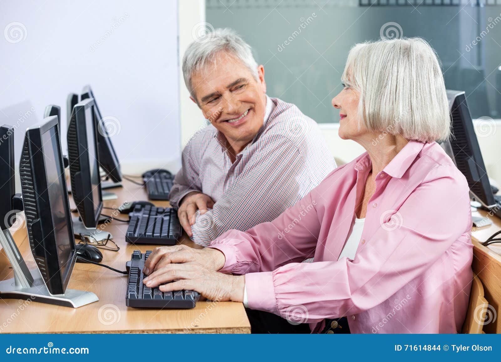 Happy Senior Students Communicating in Computer Class Stock Photo ...