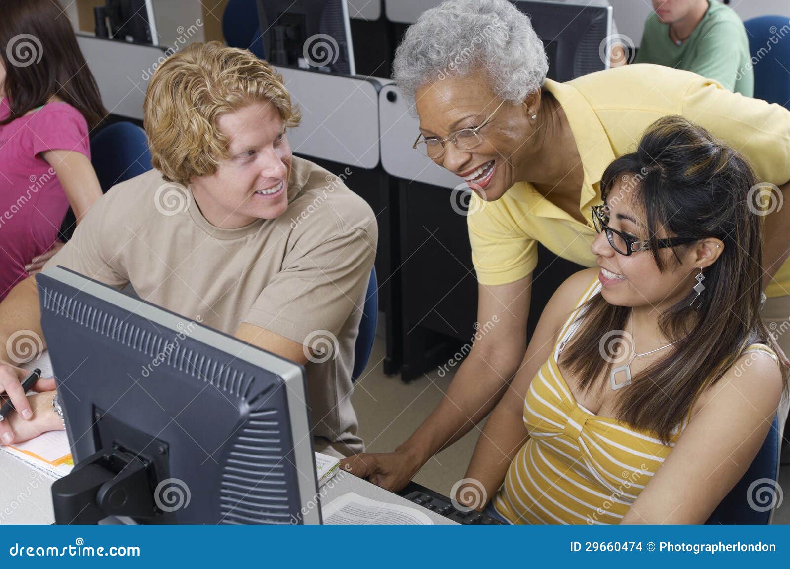 Happy Senior Teacher Assisting Students Stock Photo - Image of hispanic ...