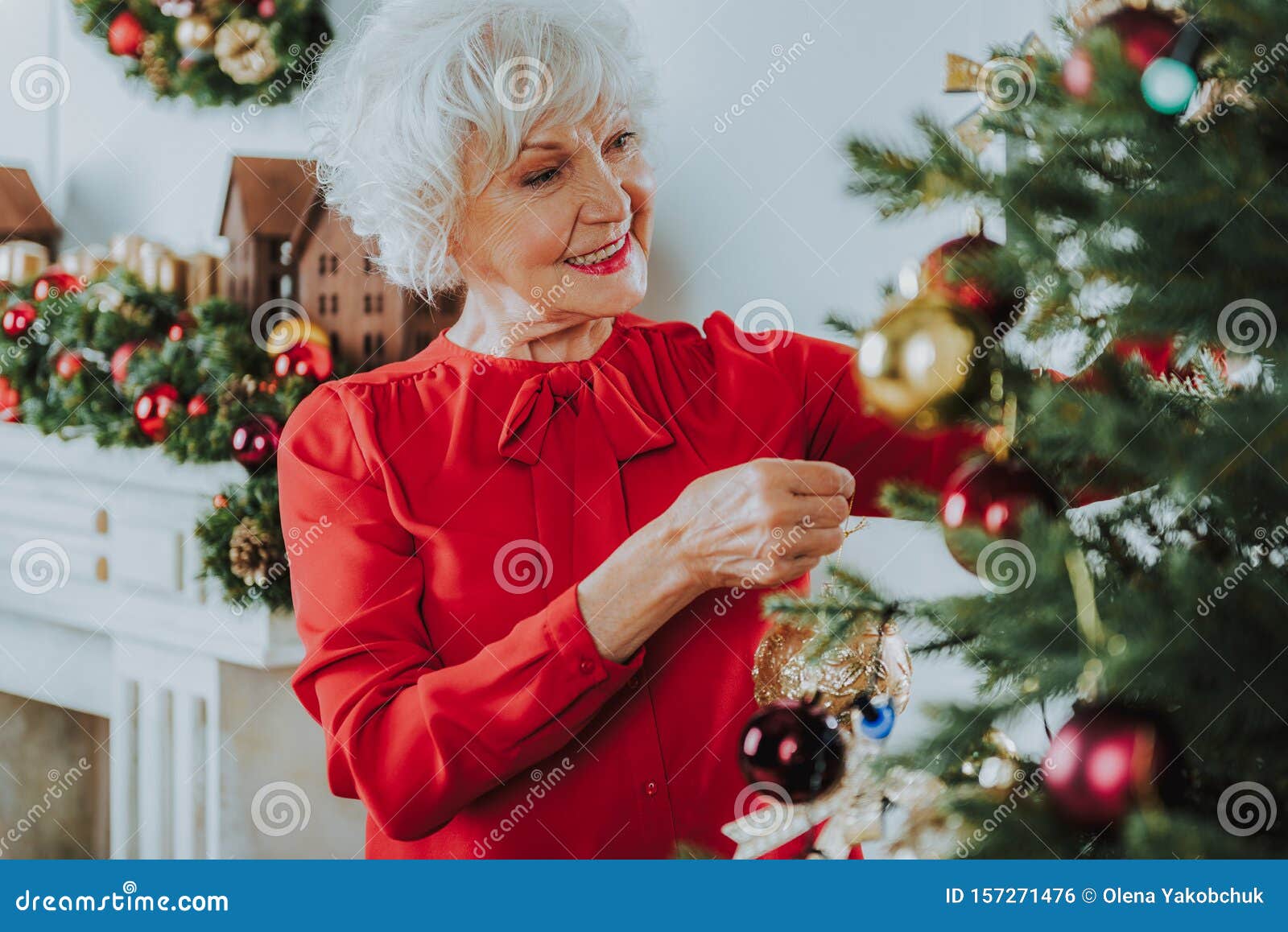 Happy Senior Woman is Decorating Christmas Tree Stock Photo - Image of ... Happy Senior Woman is Decorating Christmas Tree Stock Photo - Image of ...