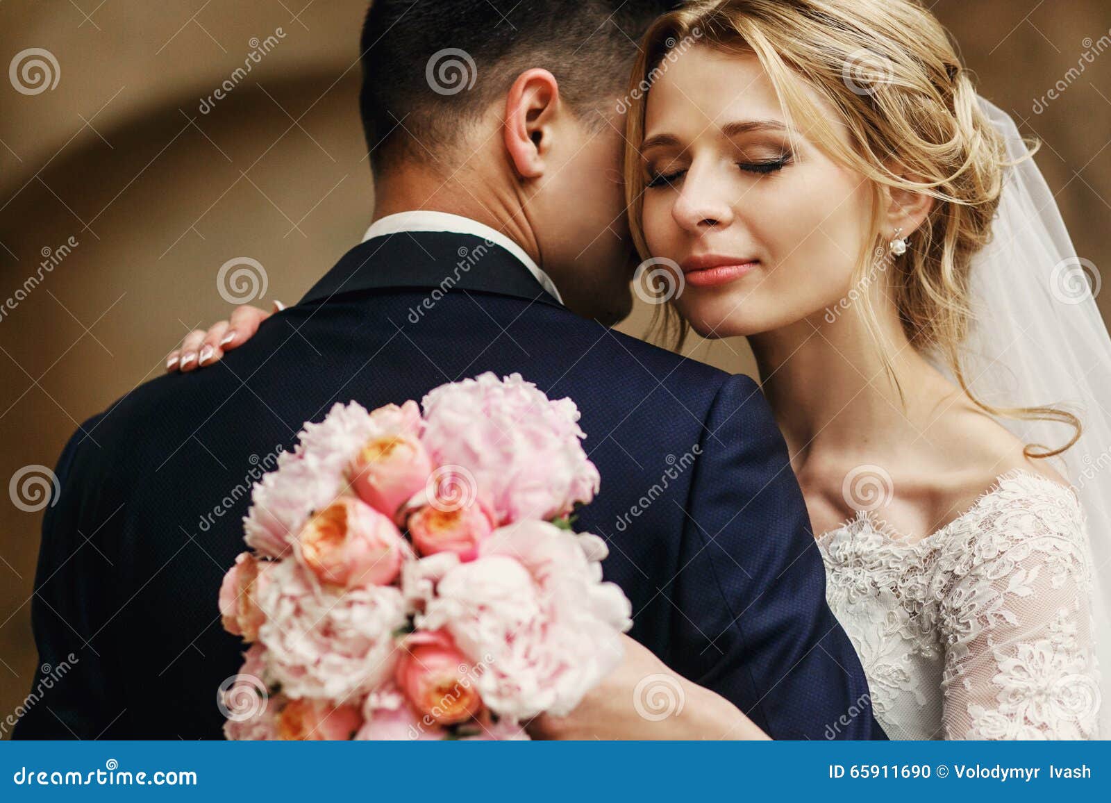 Happy Sensual Handsome Groom And Blonde Beautiful Bride In White Stock
