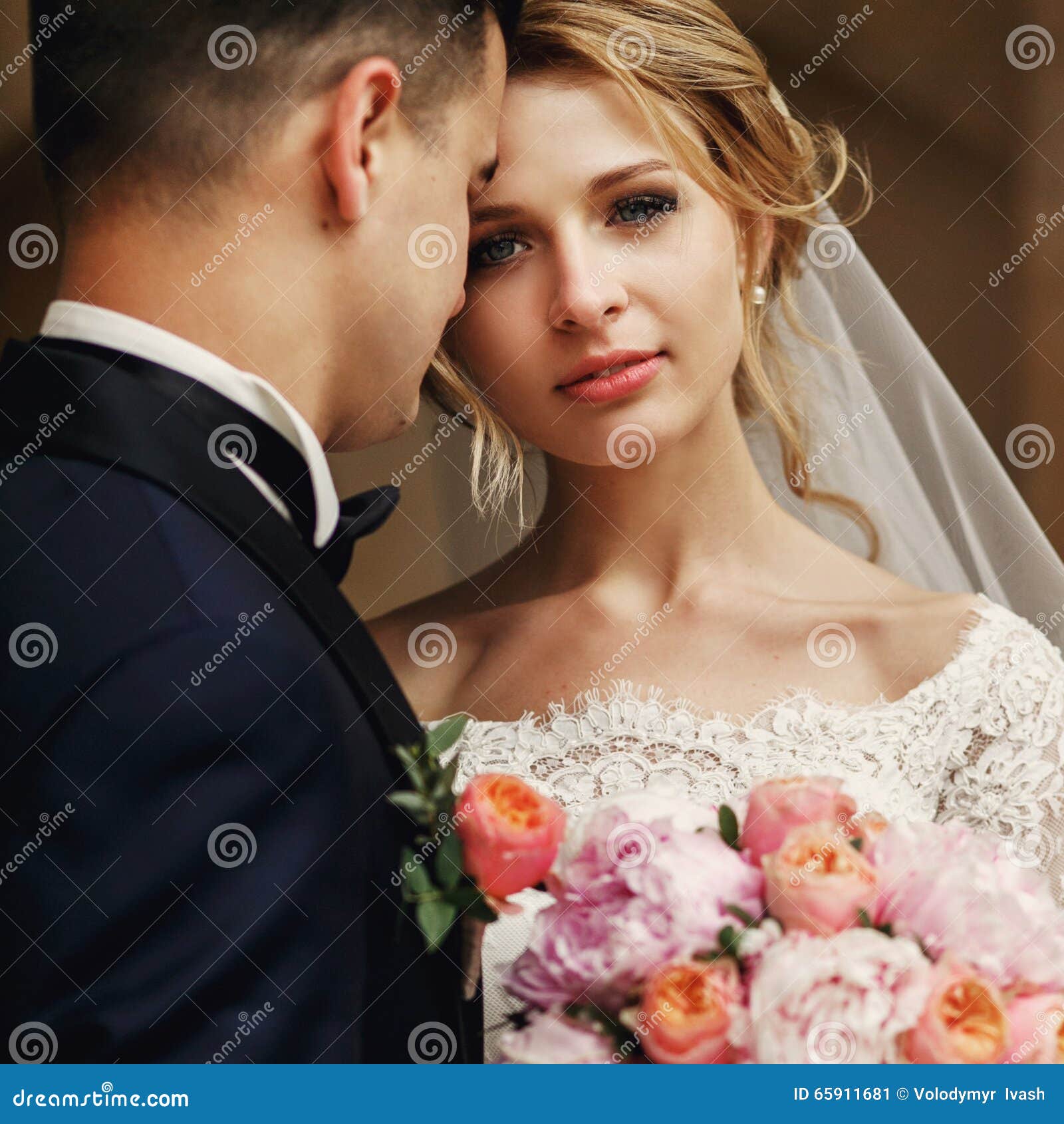 Happy Sensual Handsome Groom And Blonde Beautiful Bride In White Stock