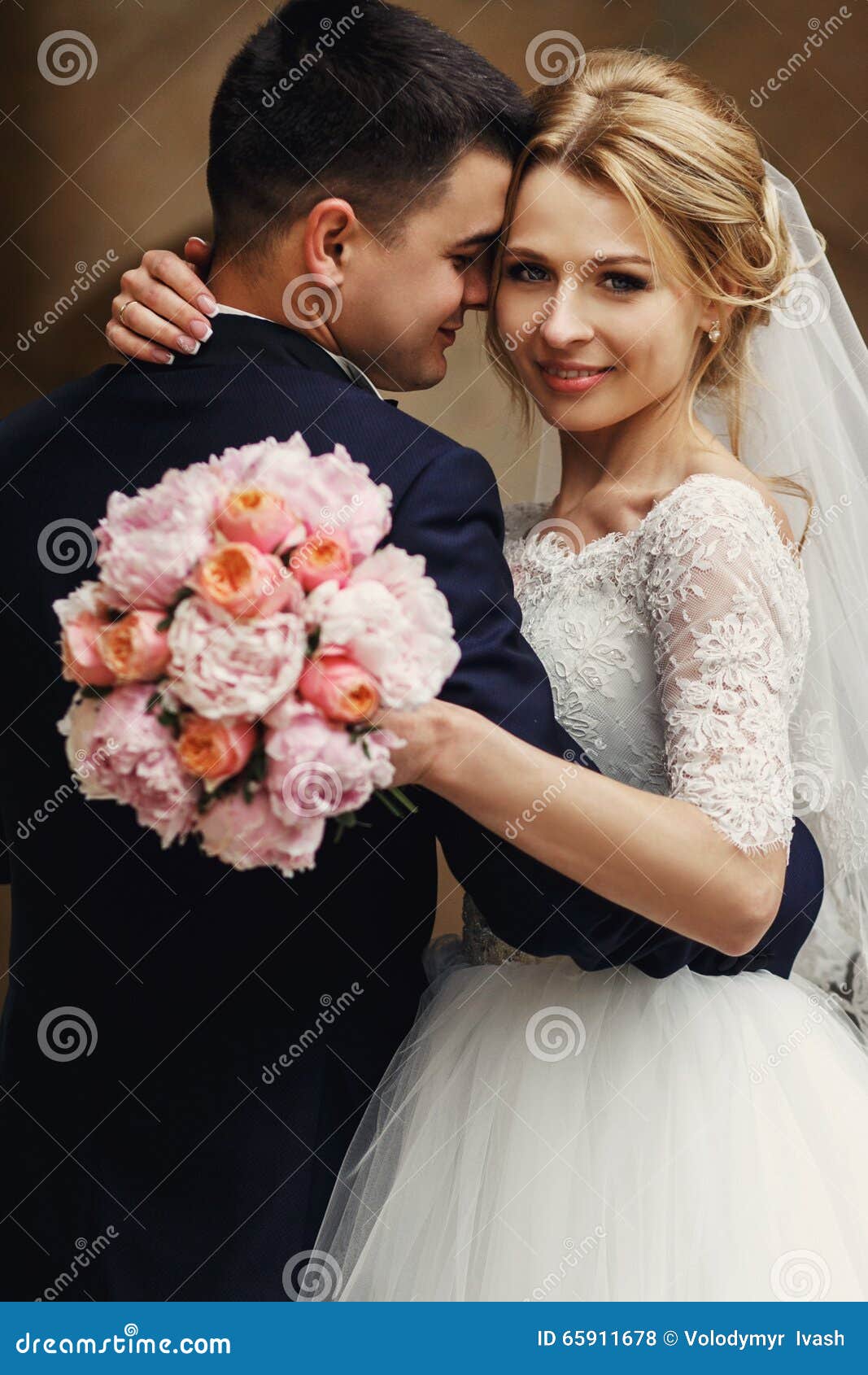 Happy Sensual Handsome Groom And Blonde Beautiful Bride In White Stock