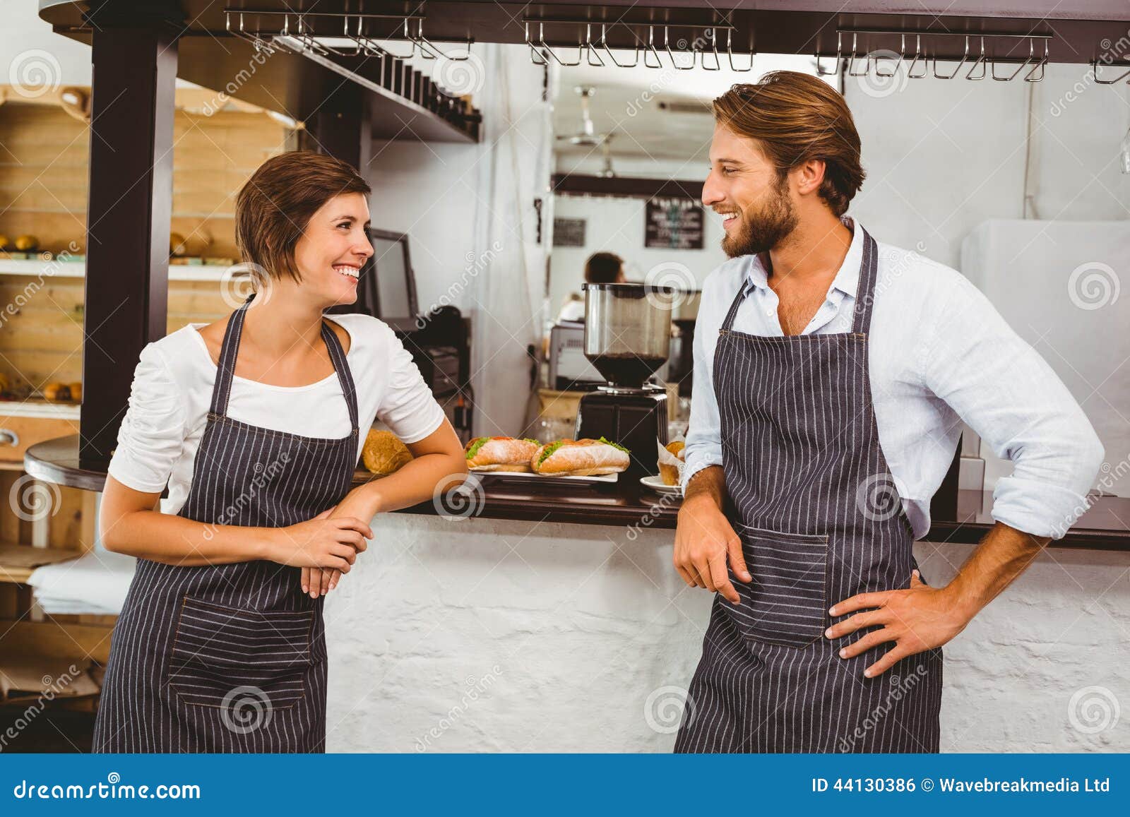 Happy Servers Chatting at the Counter Stock Photo - Image of cafe ...