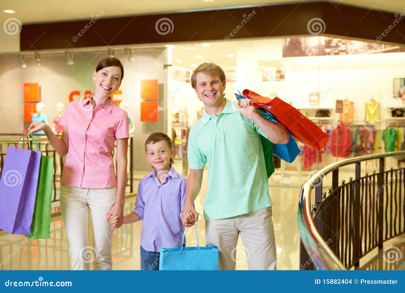 Happy shoppers stock photo. Image of male, cute, female - 15882404