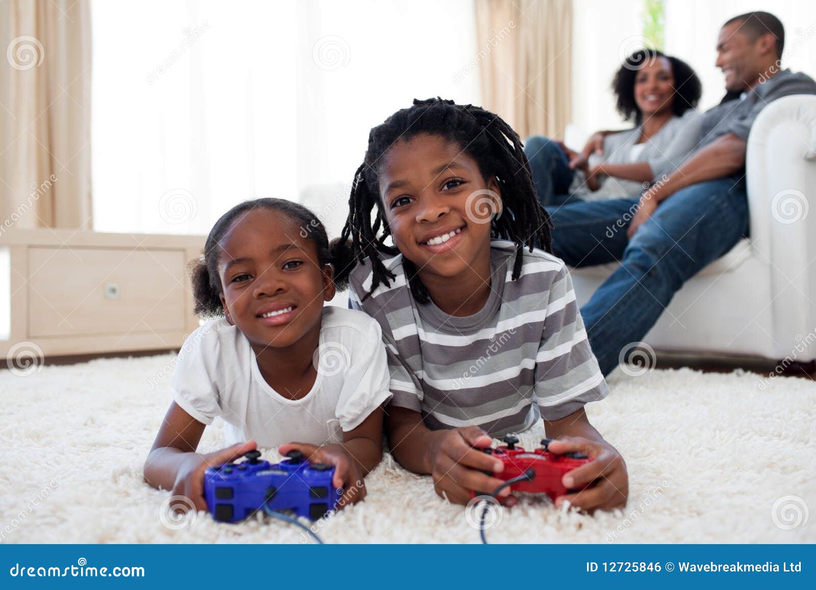 Happy Siblings Playing Video Game Stock Photo - Image of people ...