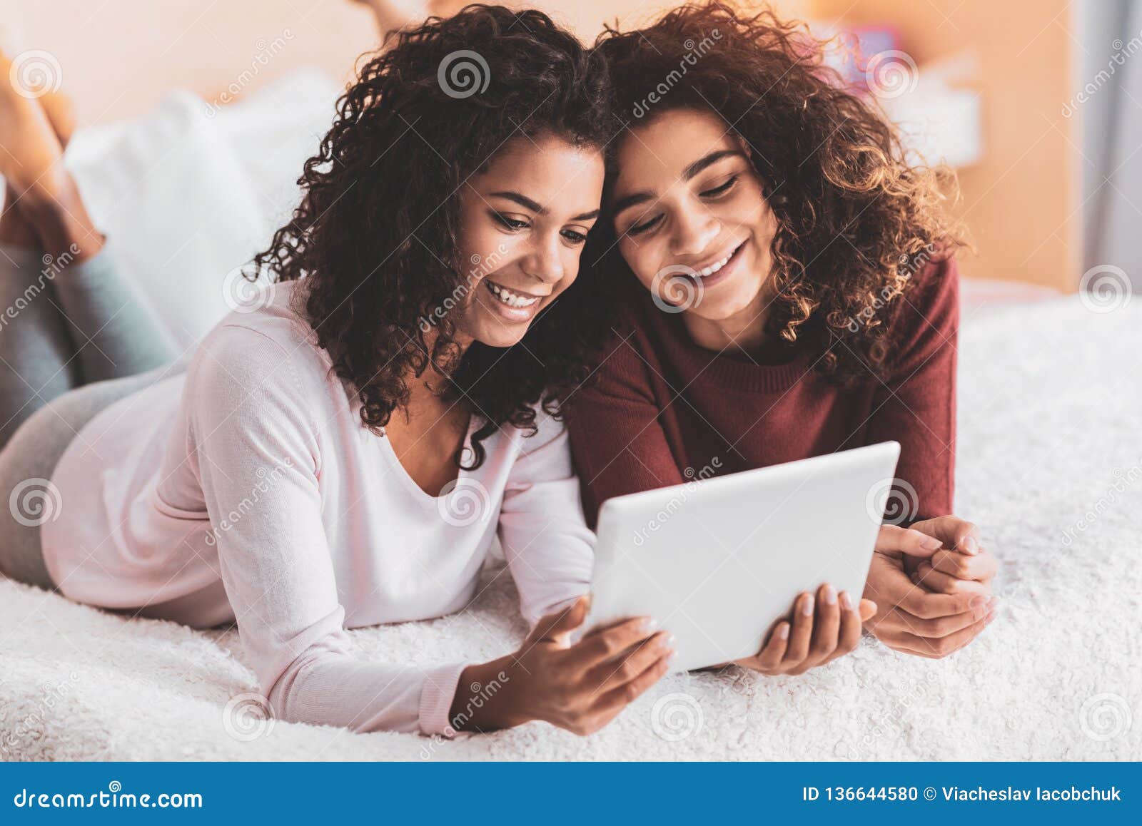 Happy Siblings Smiling Broadly while Communicating Stock Photo - Image ...