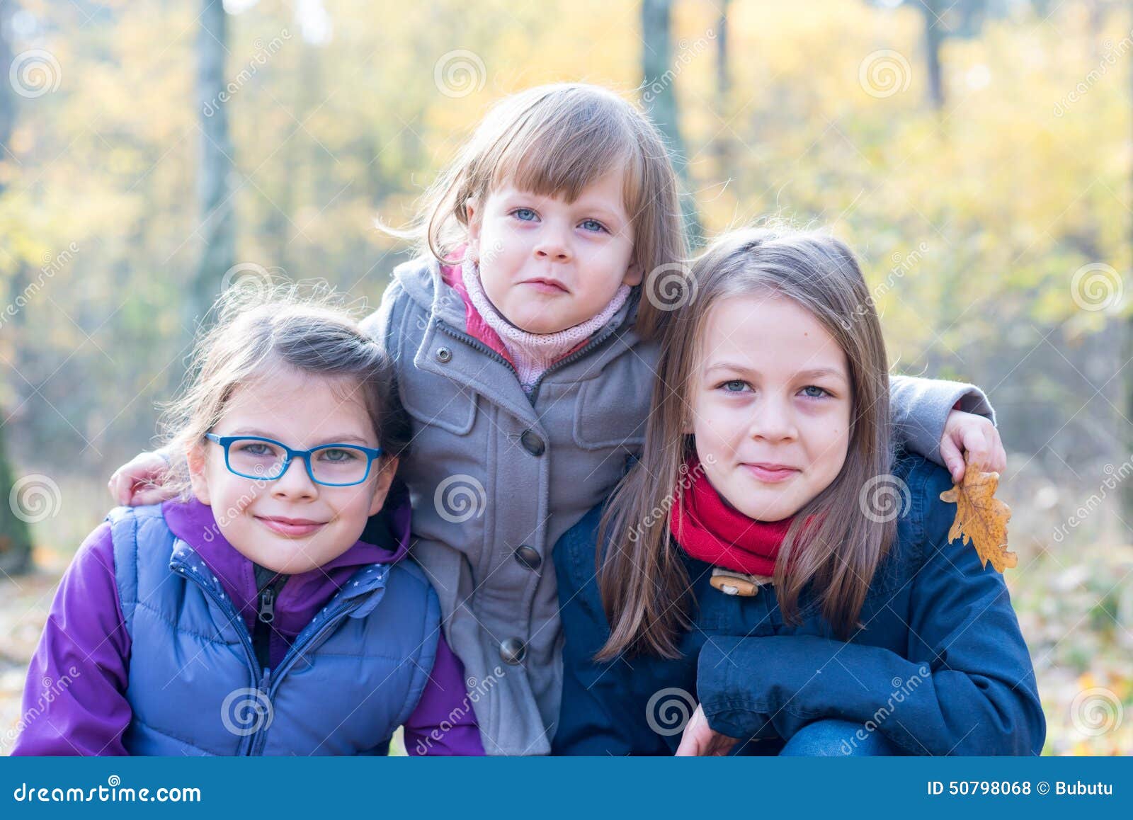 Happy Siblings - Three Sisters in the Autumnal Forest Smiling Stock ...