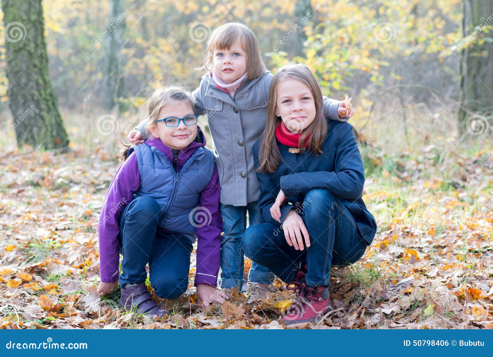 Happy Siblings - Three Sisters in the Autumnal Forest Smiling Stock ...