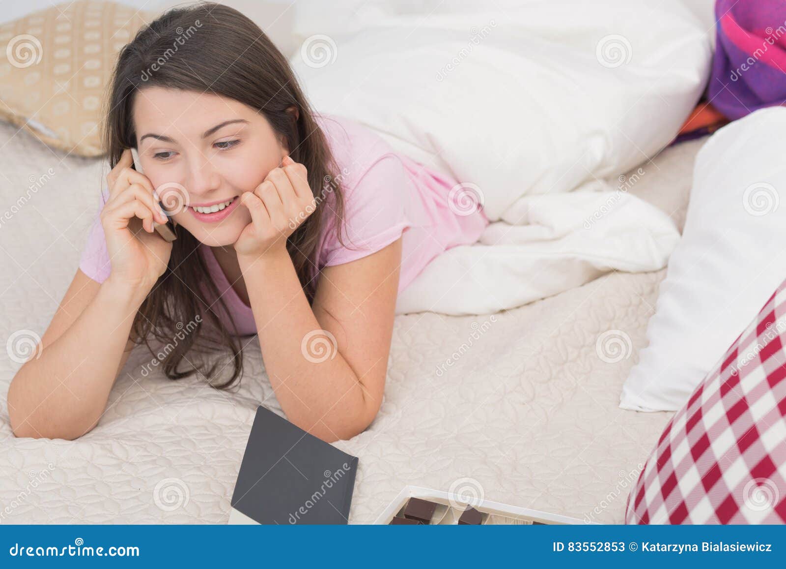 Happy single woman in bed stock image. Image of bedroom - 83552853