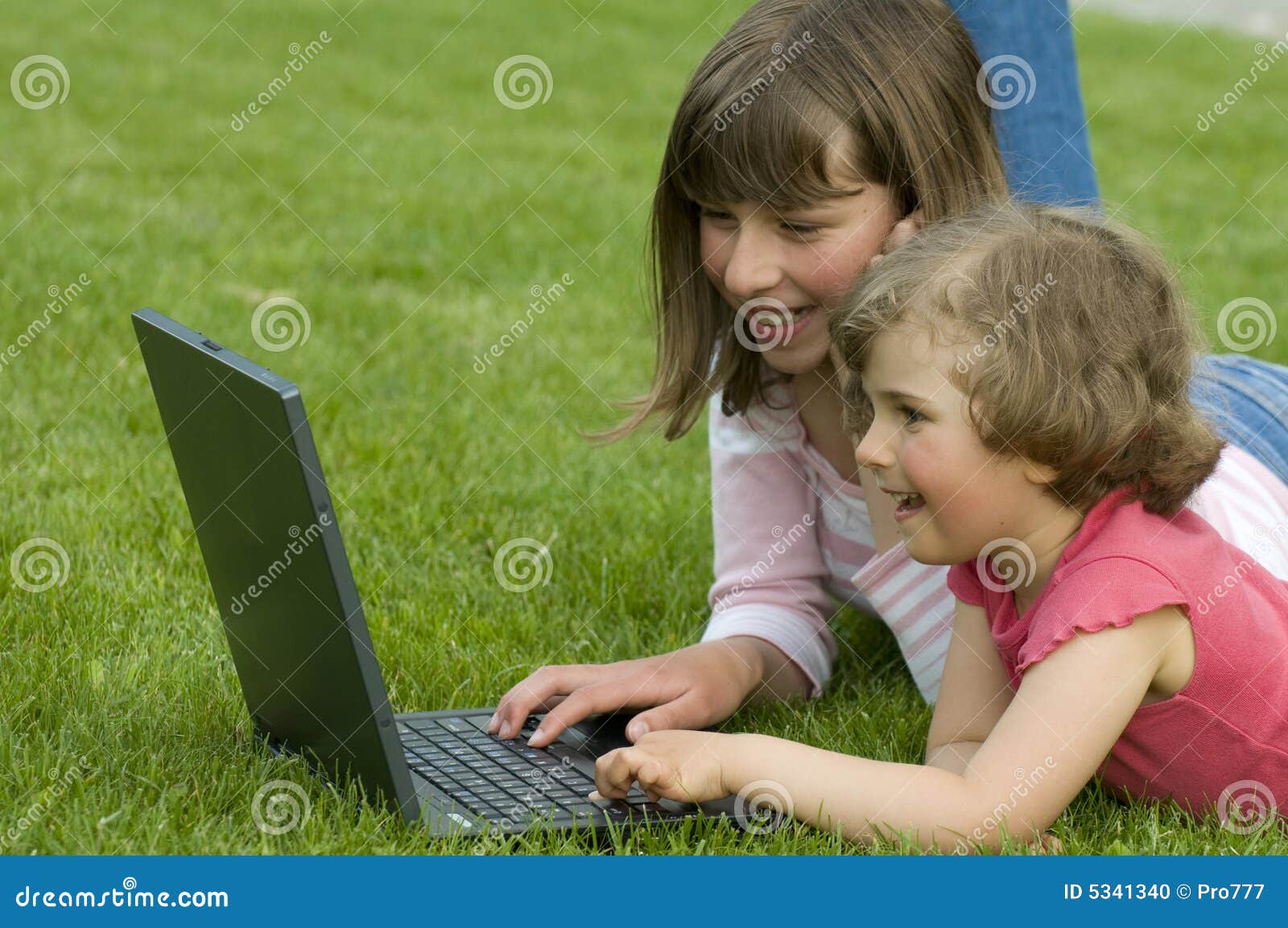 Happy Sisters with Computer Stock Photo - Image of green, female: 5341340