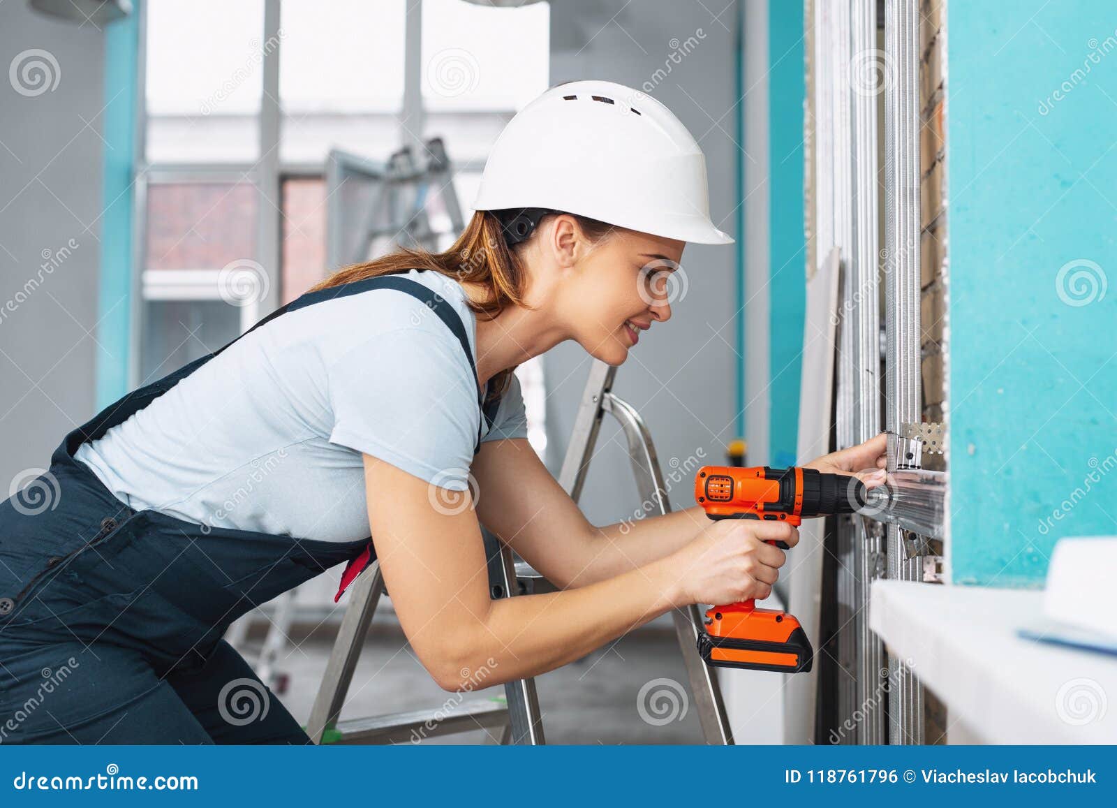 Happy Skilled Builder Working with a Drill Stock Photo - Image of ...