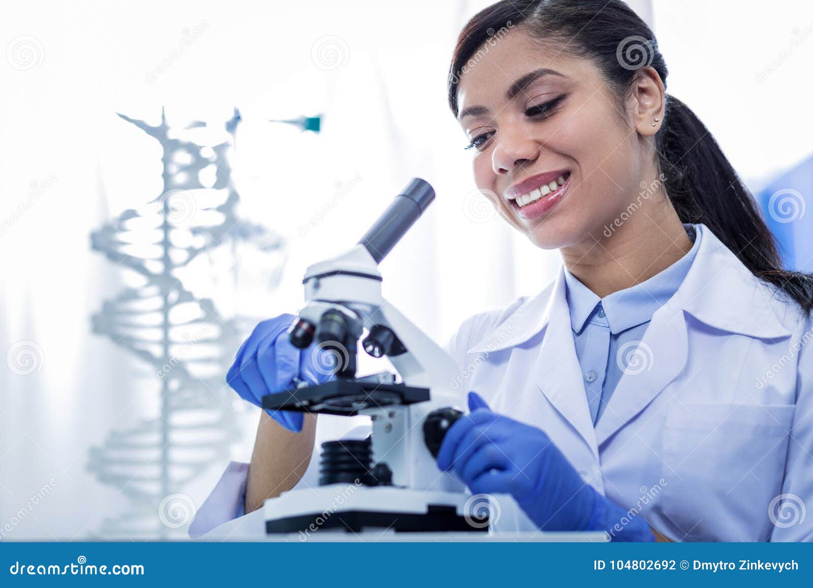 Happy Smart Biologist Using a Microscope Stock Photo - Image of ...