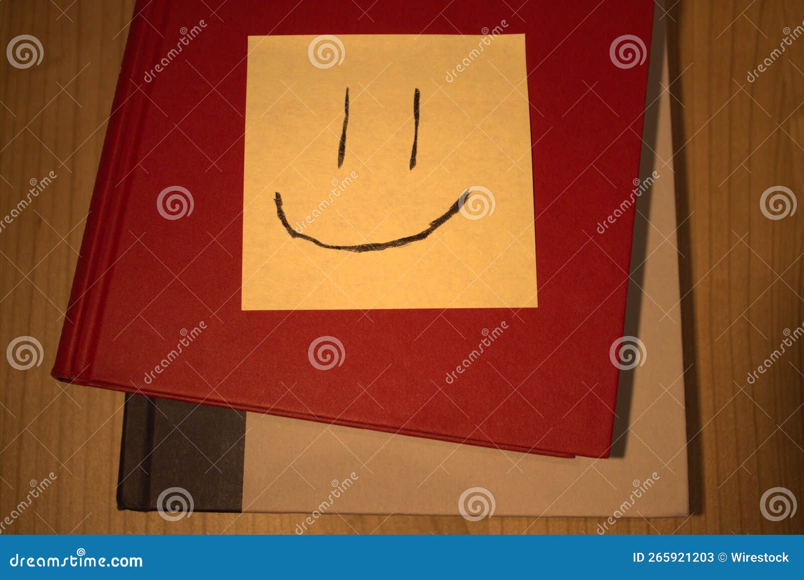 Happy smiley on book stock image. Image of happy, smiley - 265921203