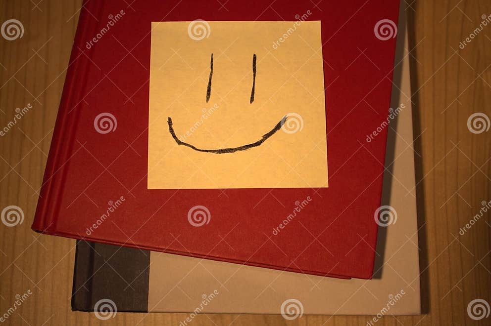 Happy smiley on book stock image. Image of happy, smiley - 265921203