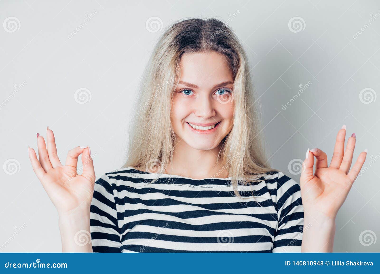 Happy Smiling Beautiful Young Business Woman Showing Ok Sign With Two