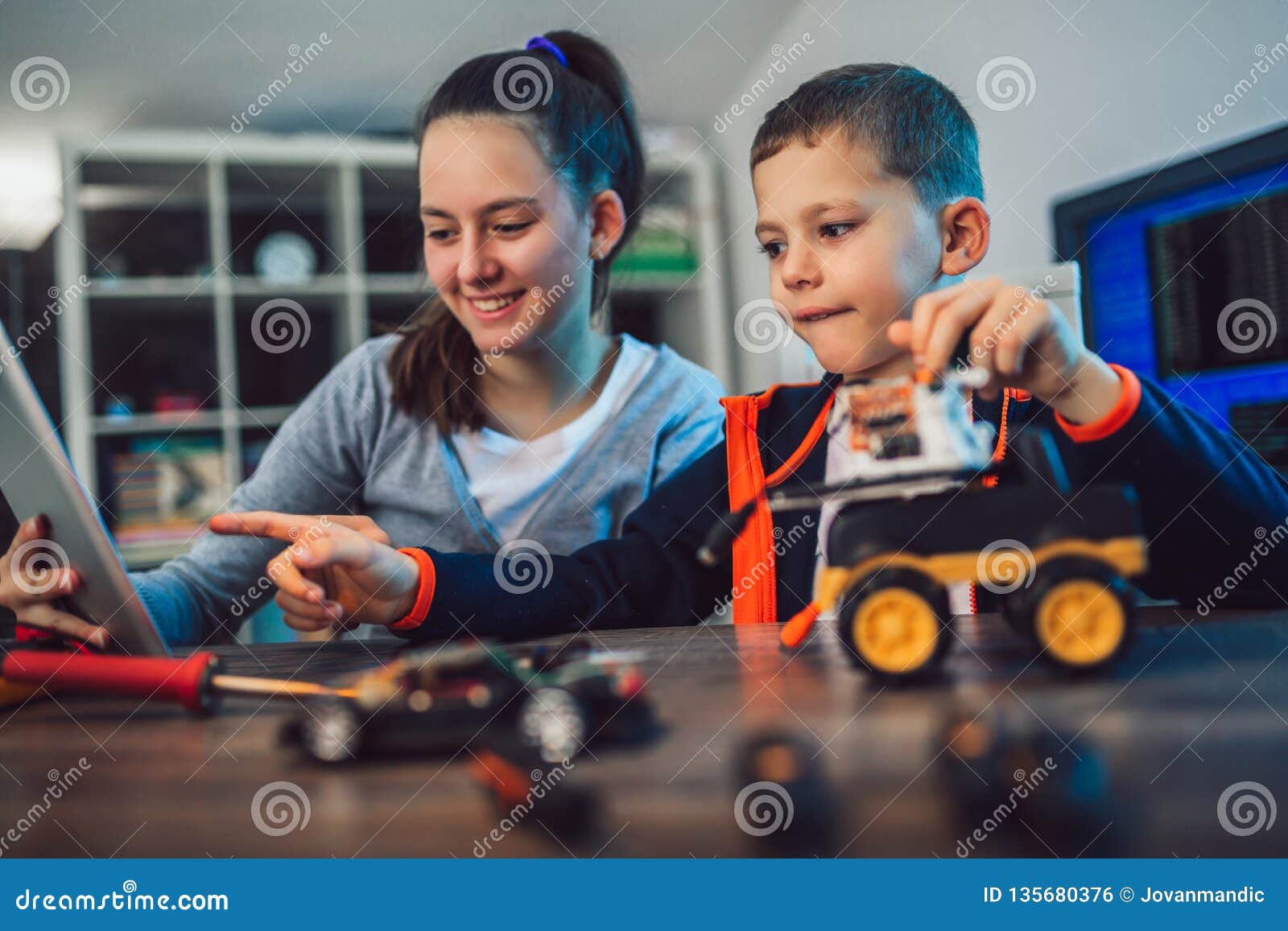 Happy Smiling Boy and Girl Constructs Technical Toy and Make Robot ...