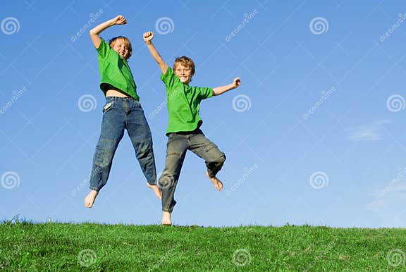 Happy Smiling Children Jumping Stock Photo - Image of summer, friends ...