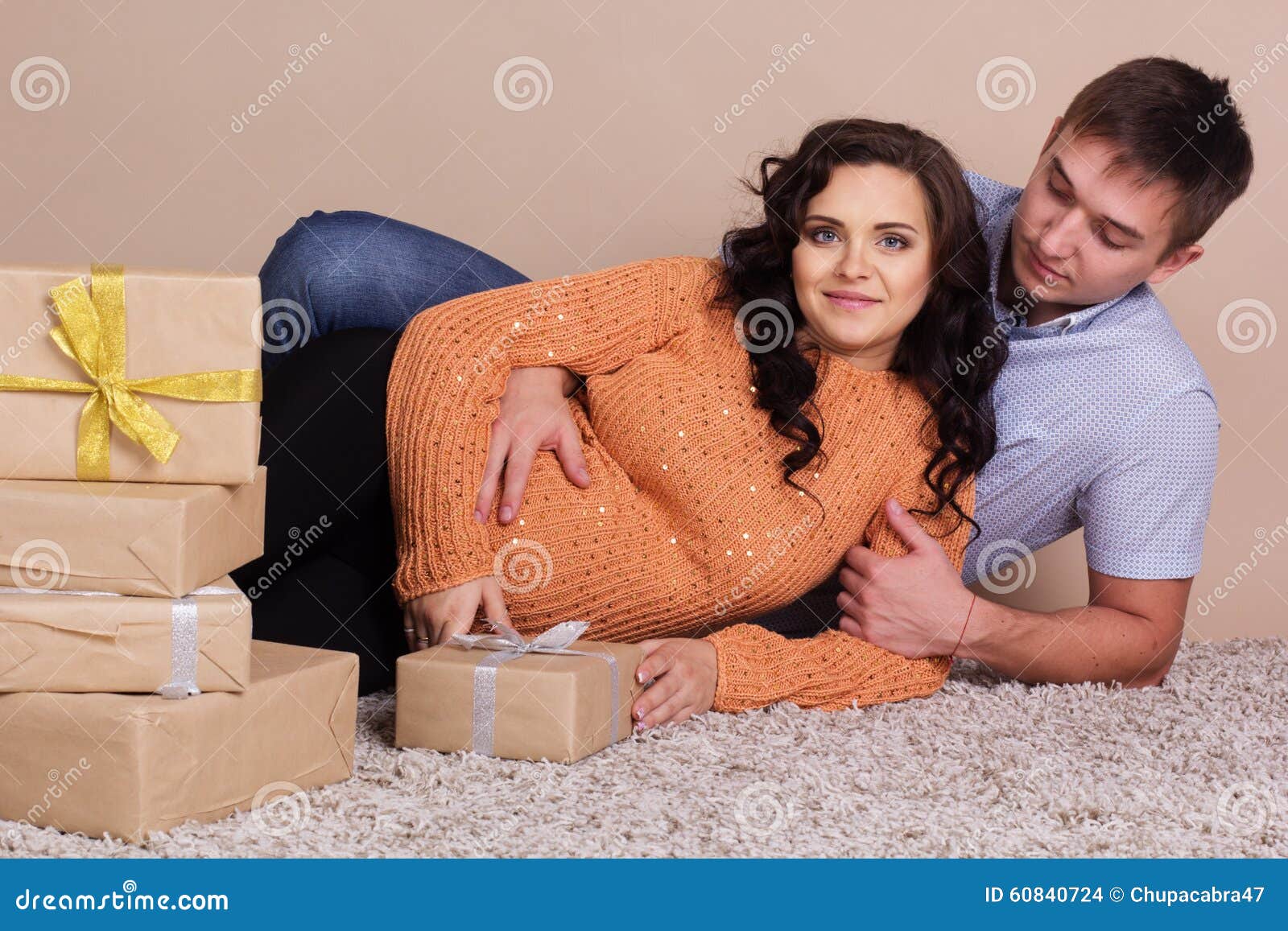 Happy Smiling Couple with Gift Boxes in Studio Stock Photo - Image of ...