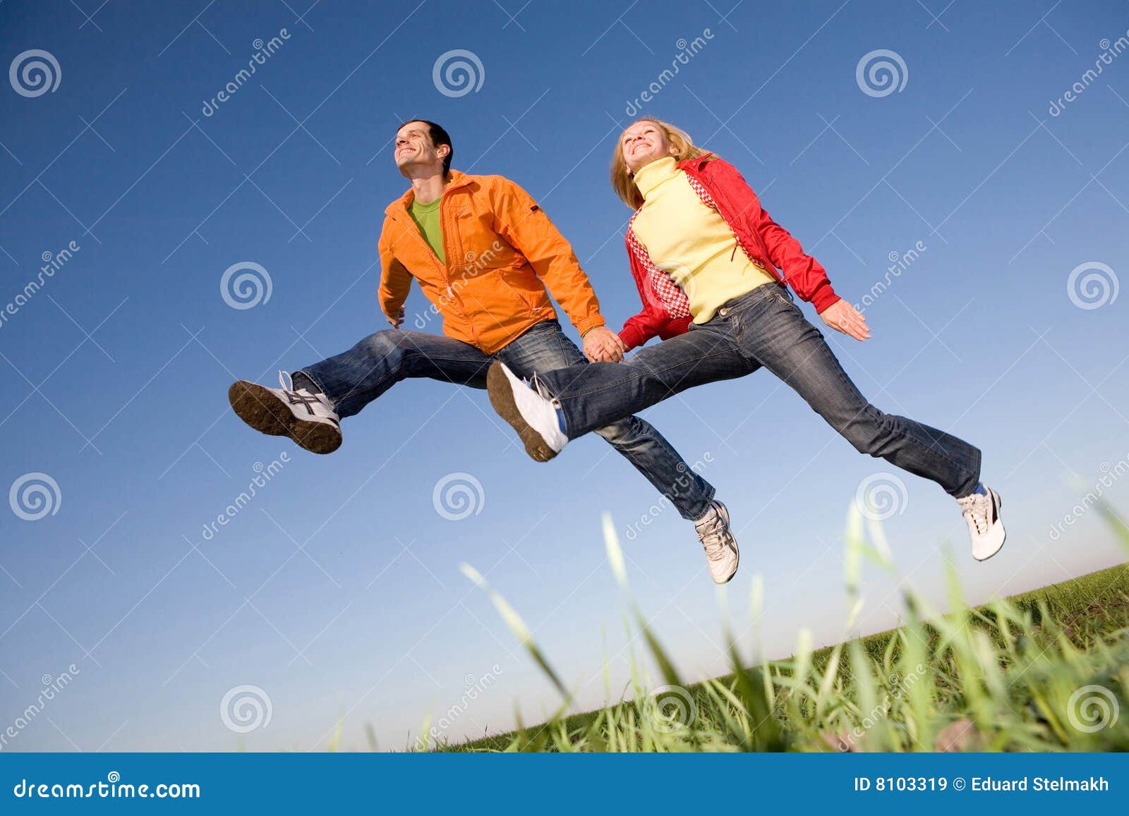 Happy Smiling Couple Jumping Stock Image - Image of happy, couple: 8103319
