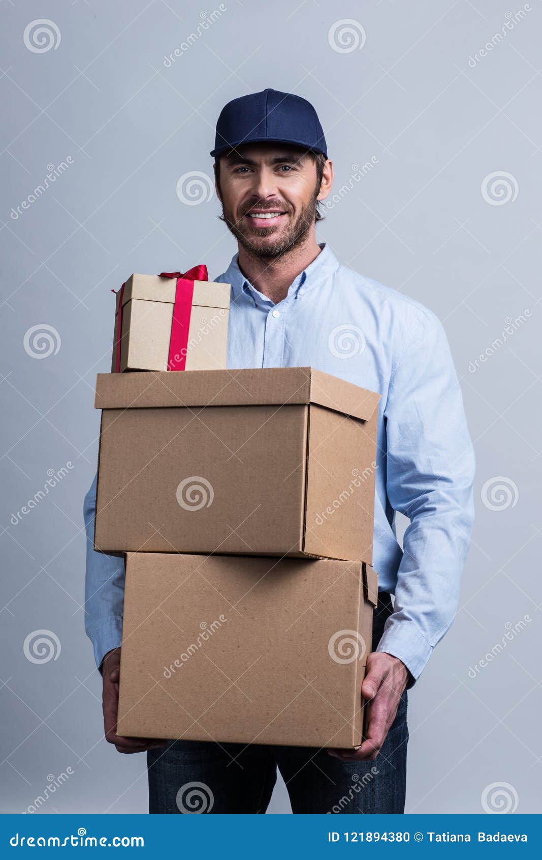 Delivery man with boxes stock photo. Image of looking - 121894380