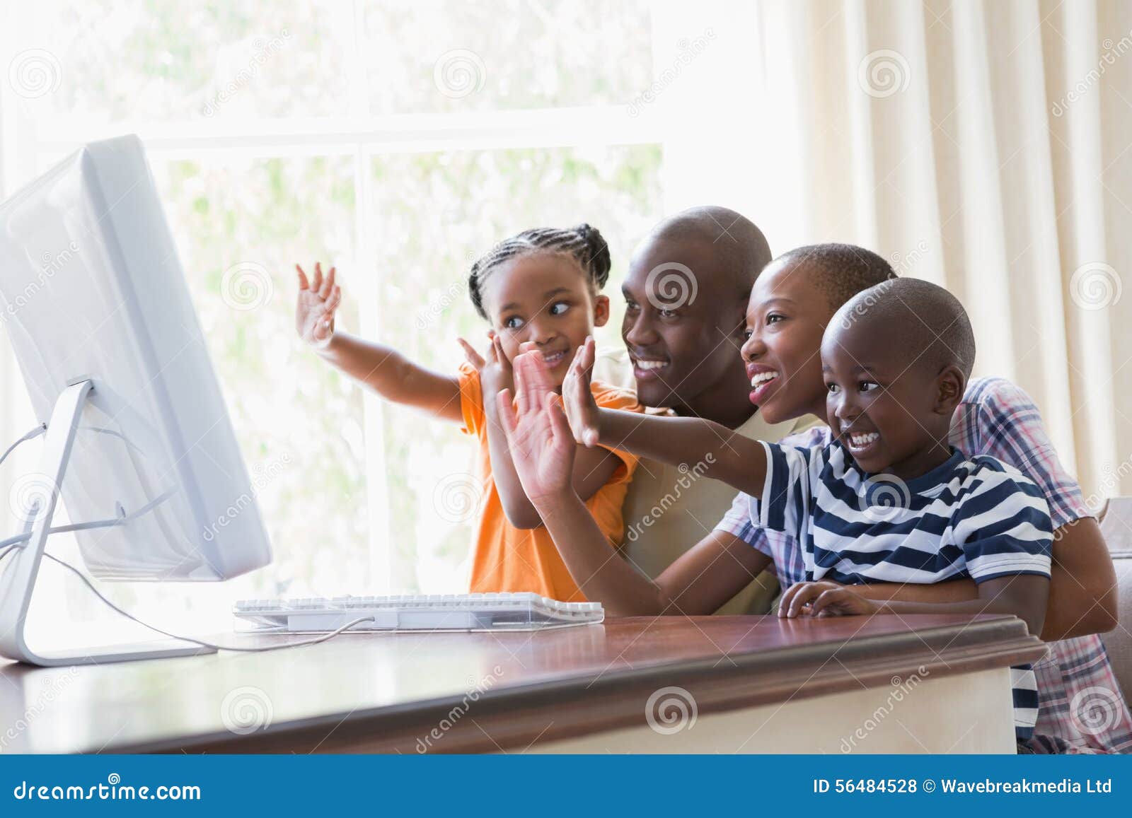 Happy Smiling Family Chatting with Computer Together Stock Photo ...