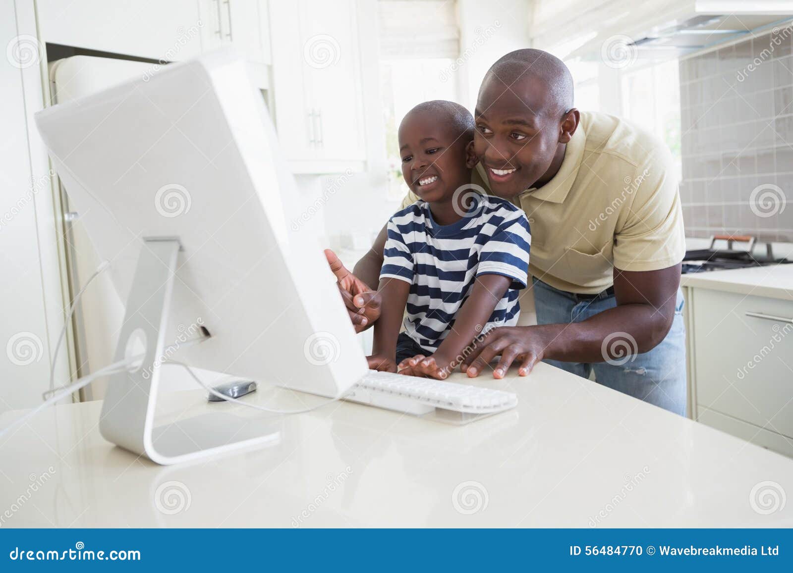 Happy Smiling Father with His Son Using Computer Stock Photo - Image of ...