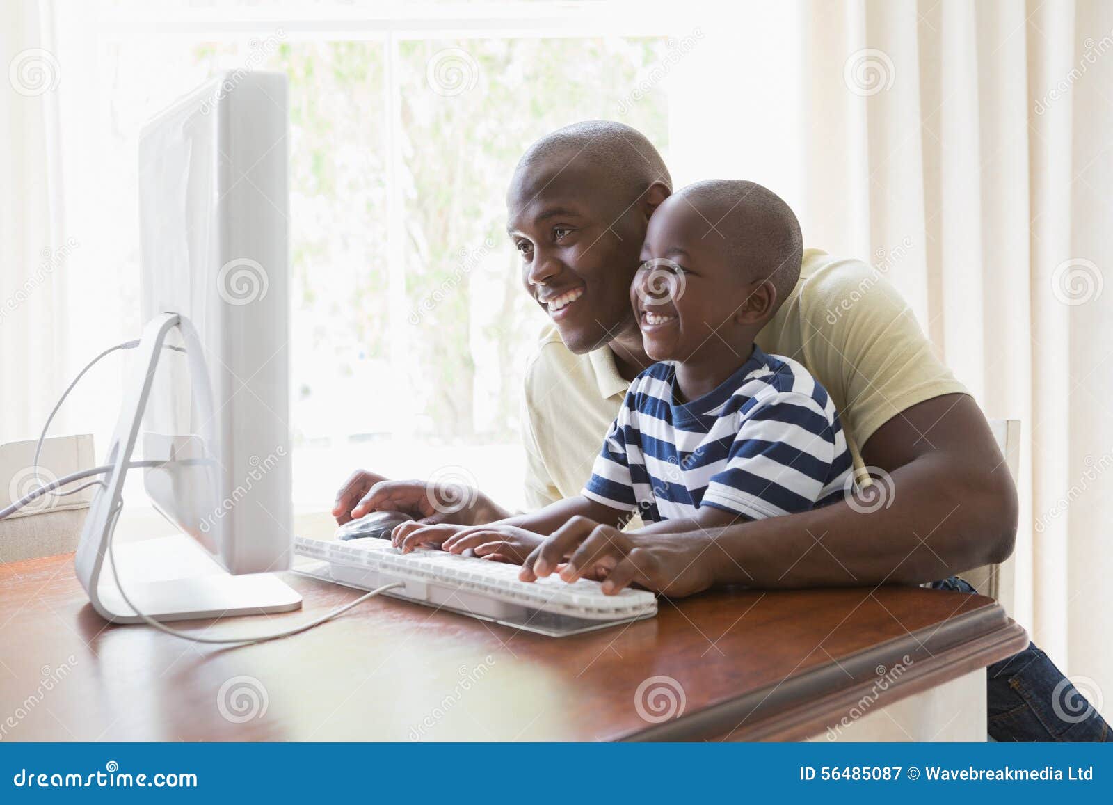 Happy Smiling Father with His Son Using Computer Stock Image - Image of ...