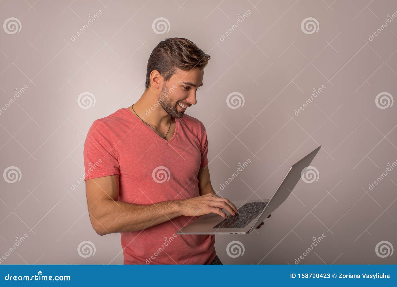 Happy Smiling Hipster Guy Keyboarding on Laptop Computer while Standing ...