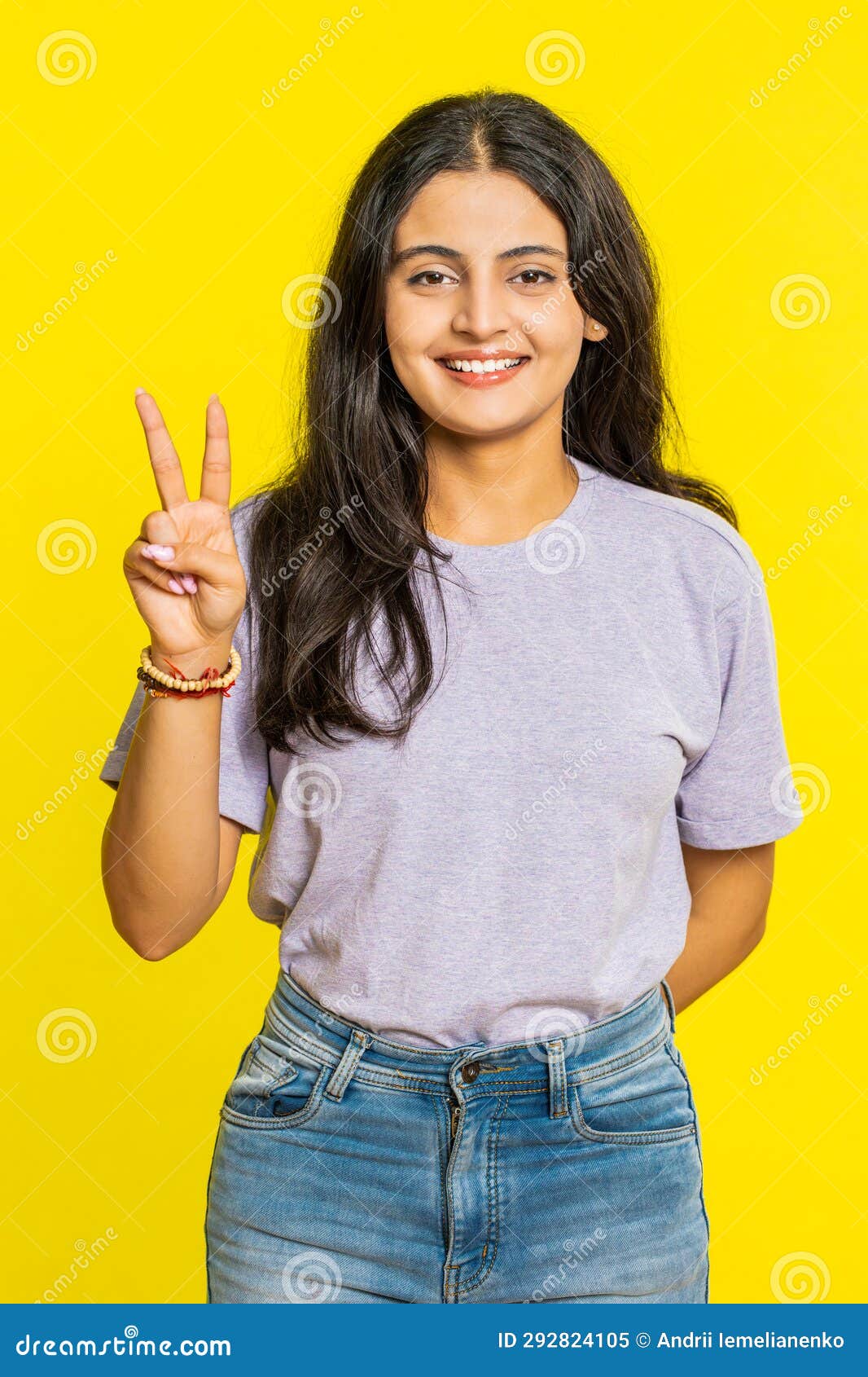Happy Smiling Indian Woman Girl Showing Victory Sign Hoping For