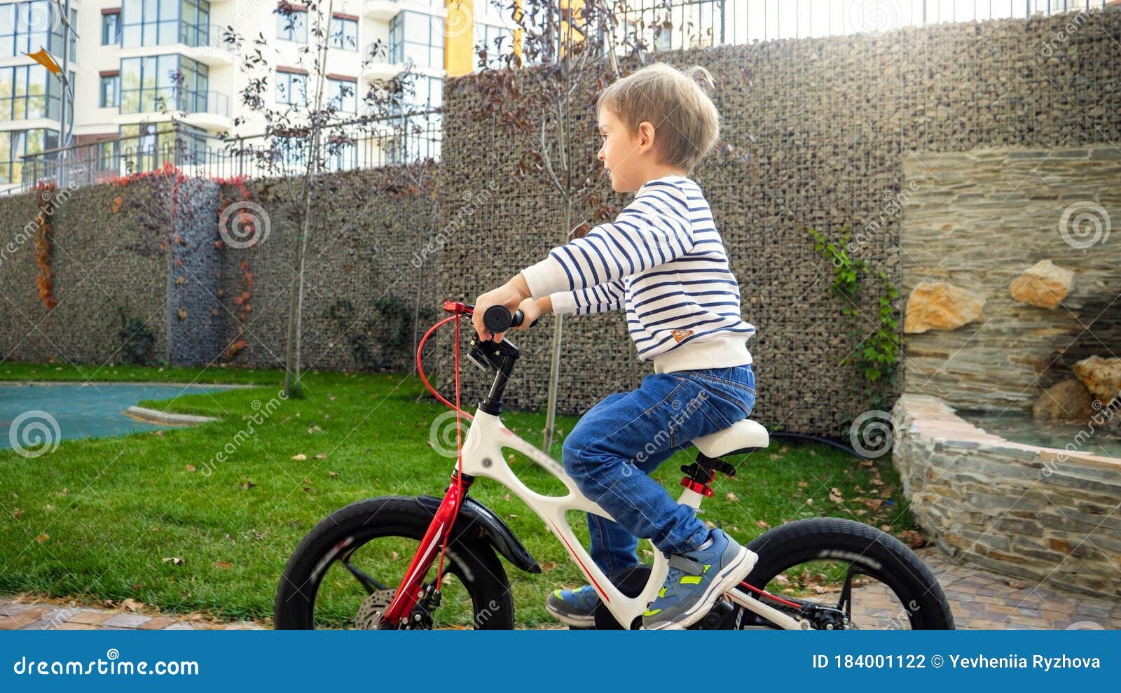 Happy Smiling Little Boy Riding His First Bicycle at Park Stock Photo ...