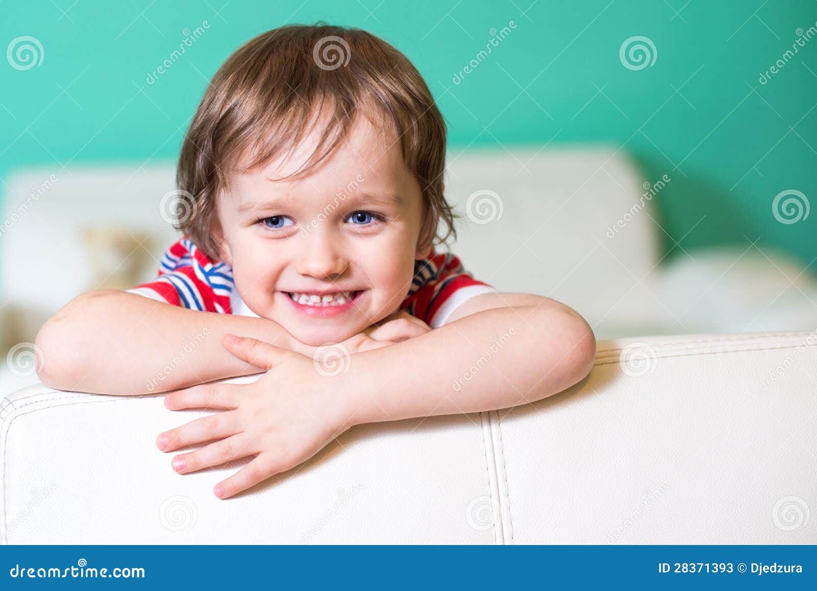Happy Smiling Little Child Boy Sitting on a Sofa Stock Image - Image of ...