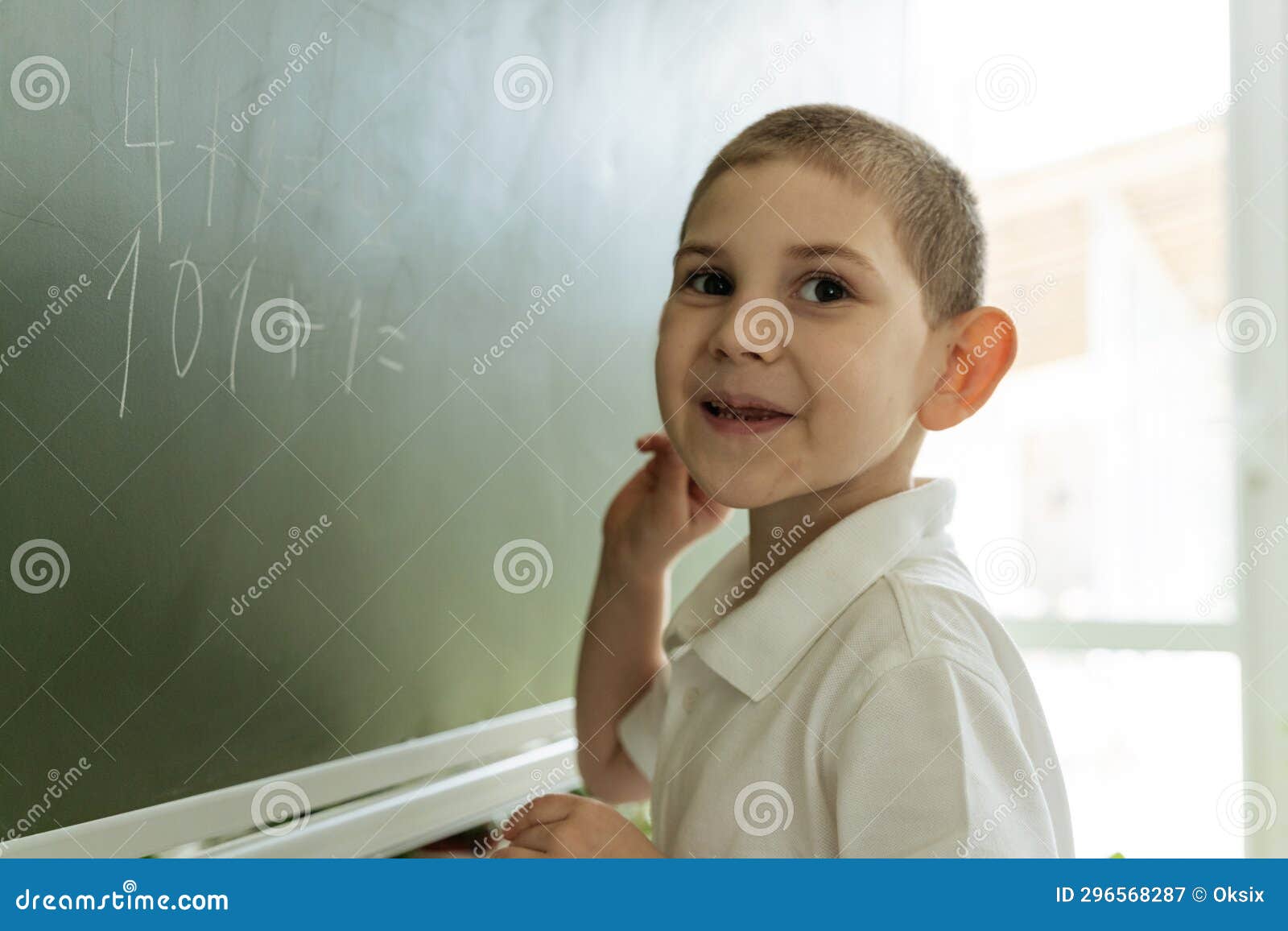 Happy Smiling Little Kid Boy Writes Mathematics on the Board Stock ...