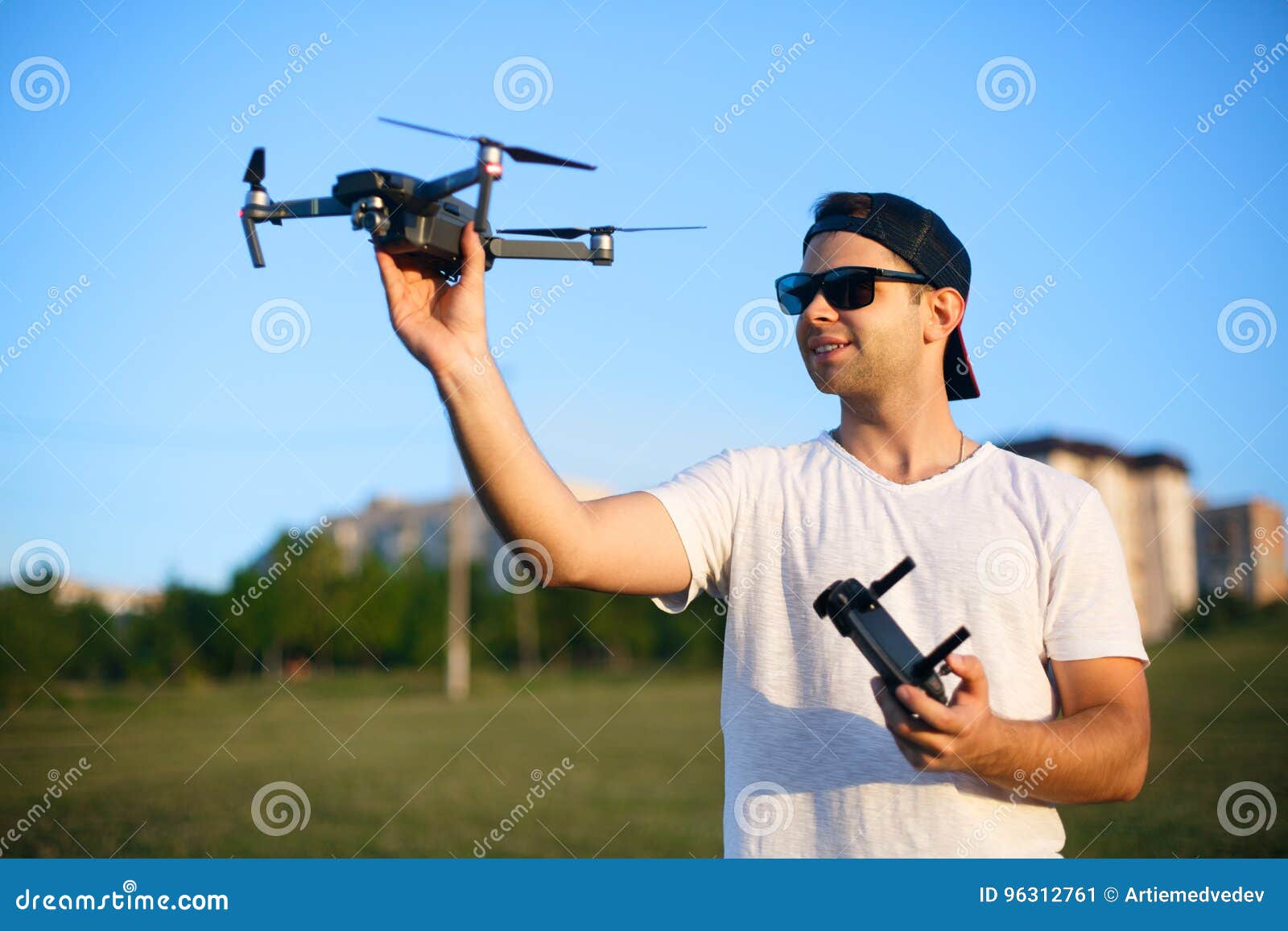 Happy Smiling Man Holds Small Compact Drone and Remote Controller in ...
