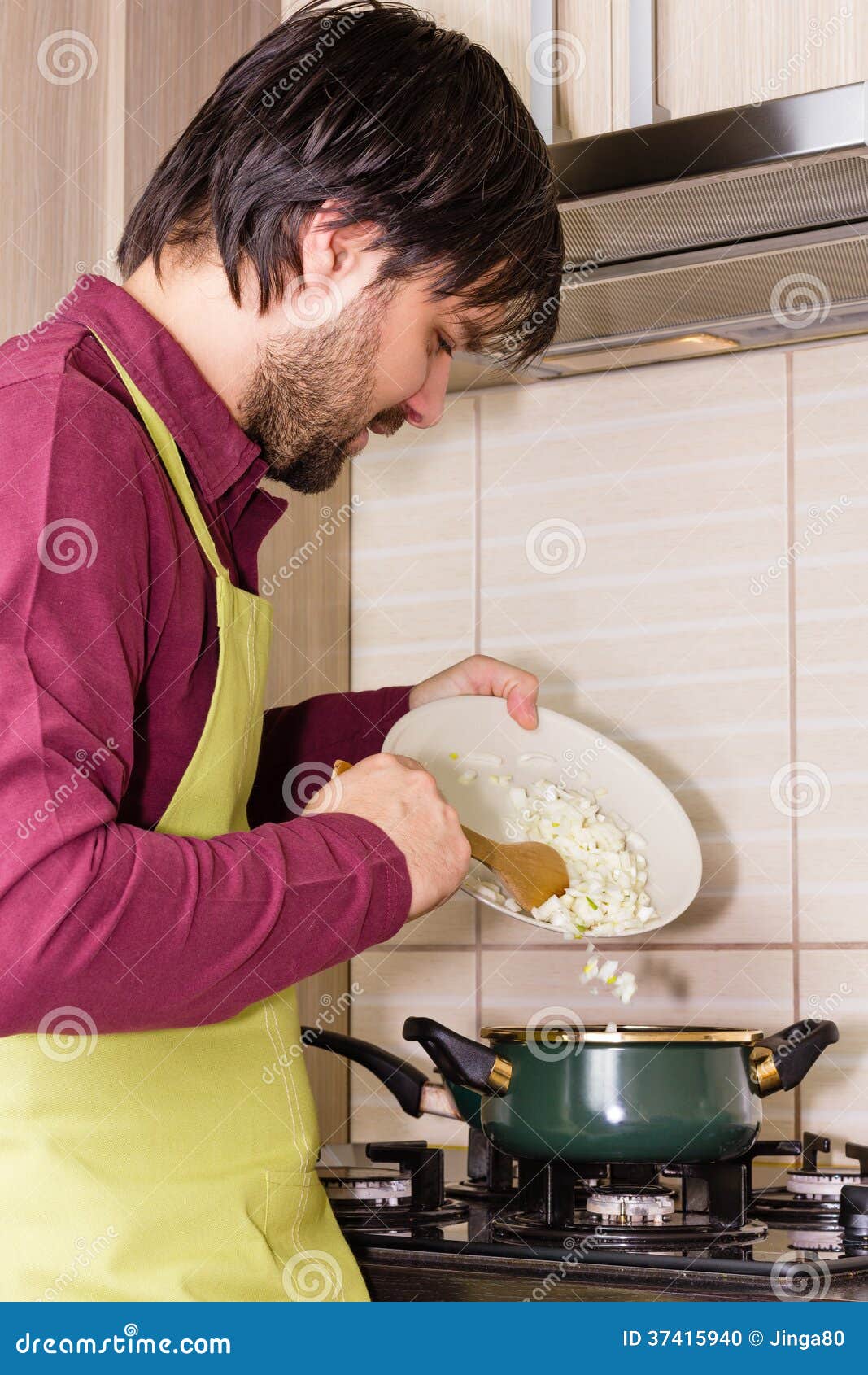 Happy Smiling Man Putting Chopped Onion in the Pan Stock Photo - Image ...