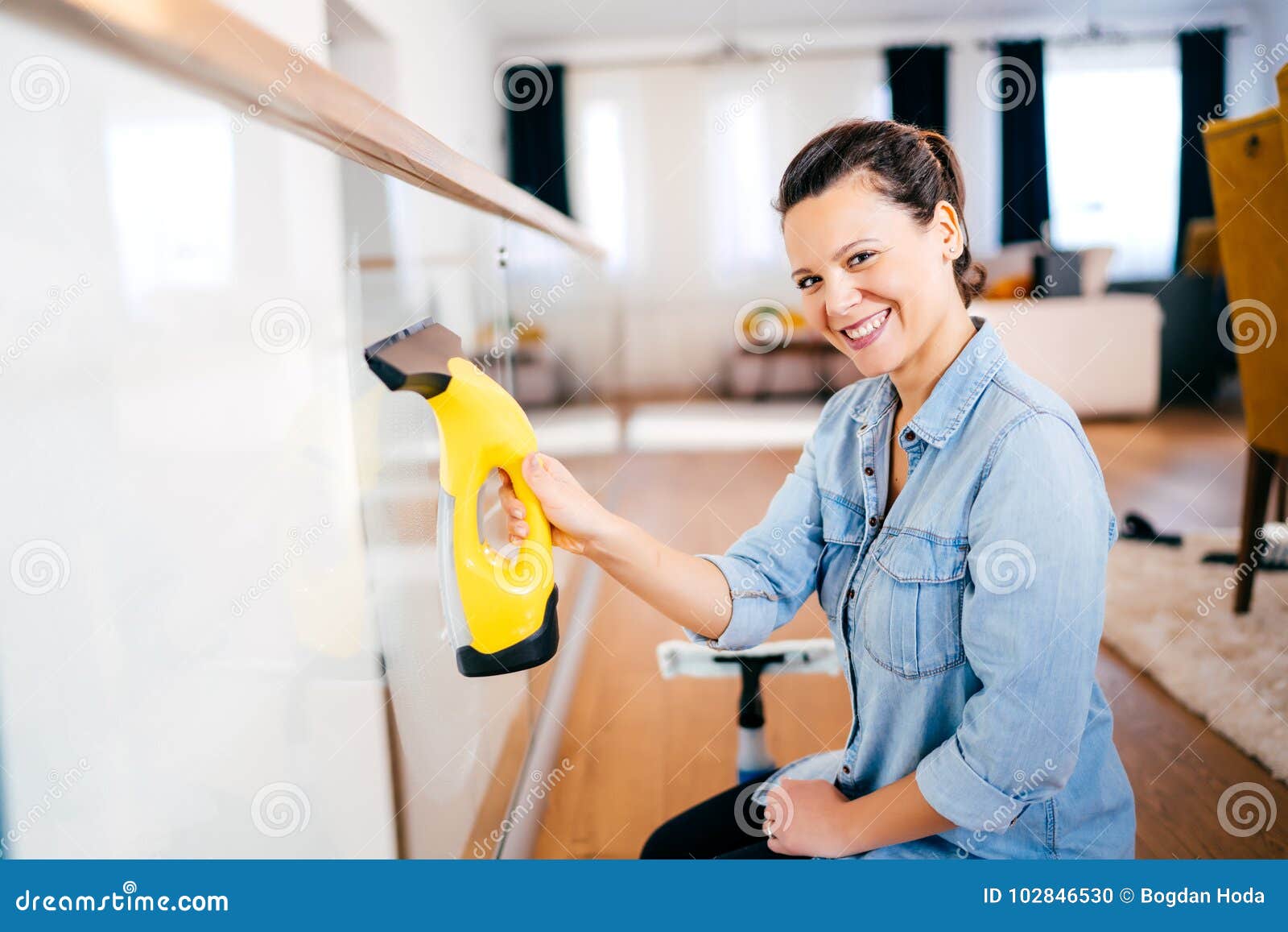 Happy, Smiling Woman Using Window Cleaner and Detergent Stock Photo ...