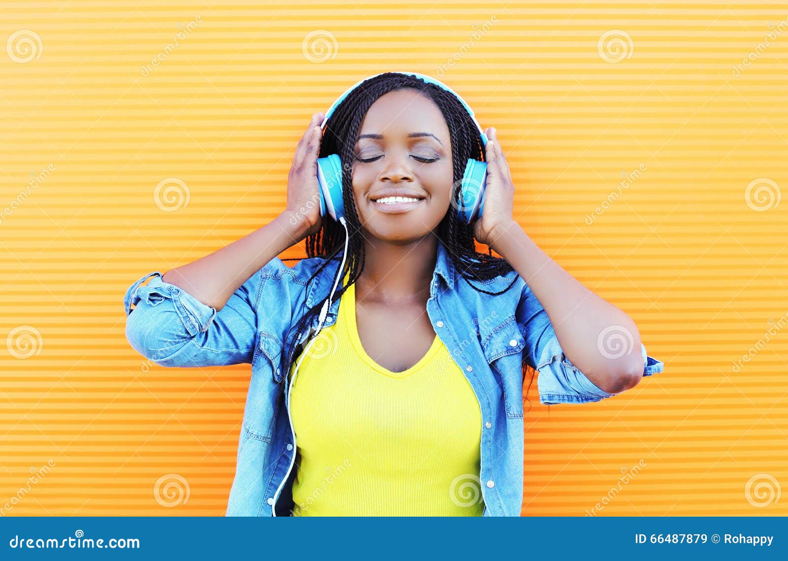 Happy Smiling Young African Woman With Headphones Enjoying Listens To