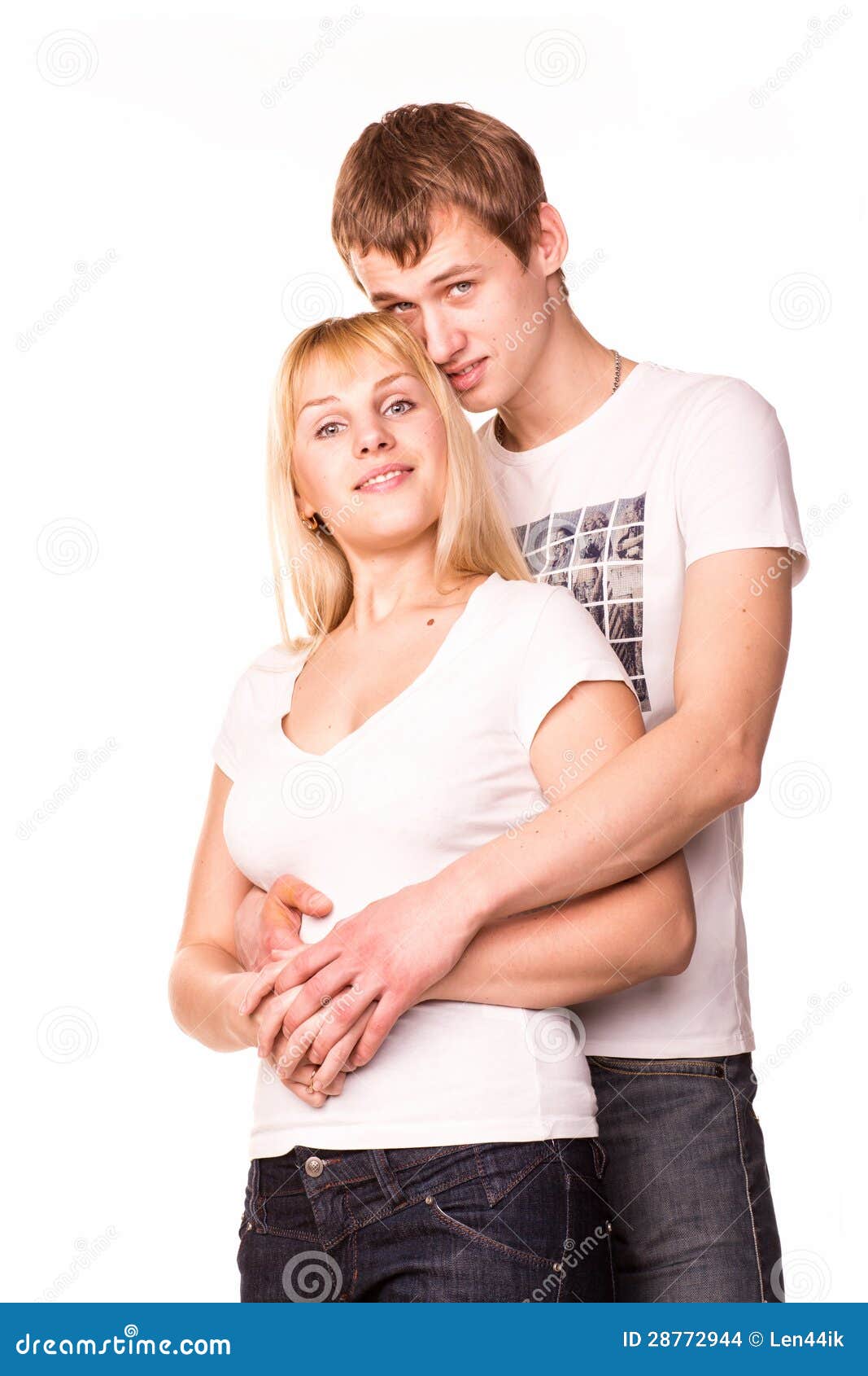 Happy Smiling Young Couple Standing Together Hugging Stock Photo ...
