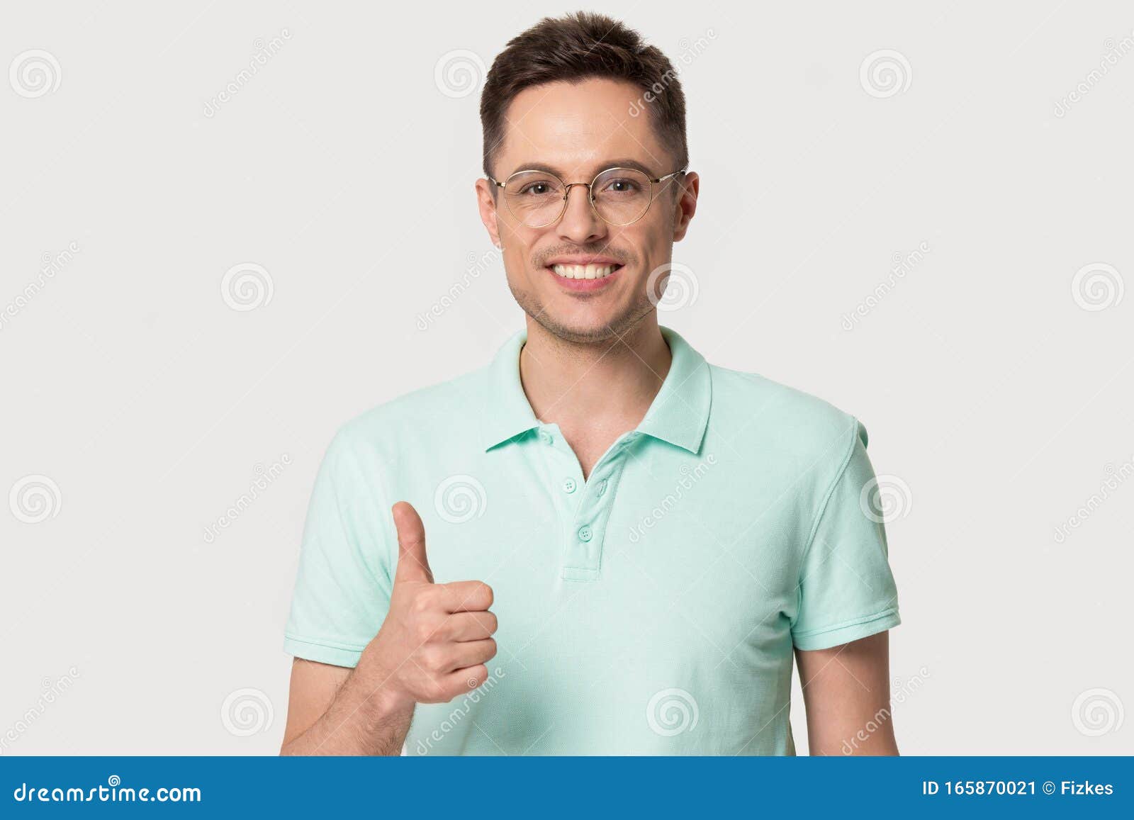 Happy Smiling Young Man in Glasses Showing Thumbs Up. Stock Image ... Happy Smiling Young Man in Glasses Showing Thumbs Up. Stock Image ...
