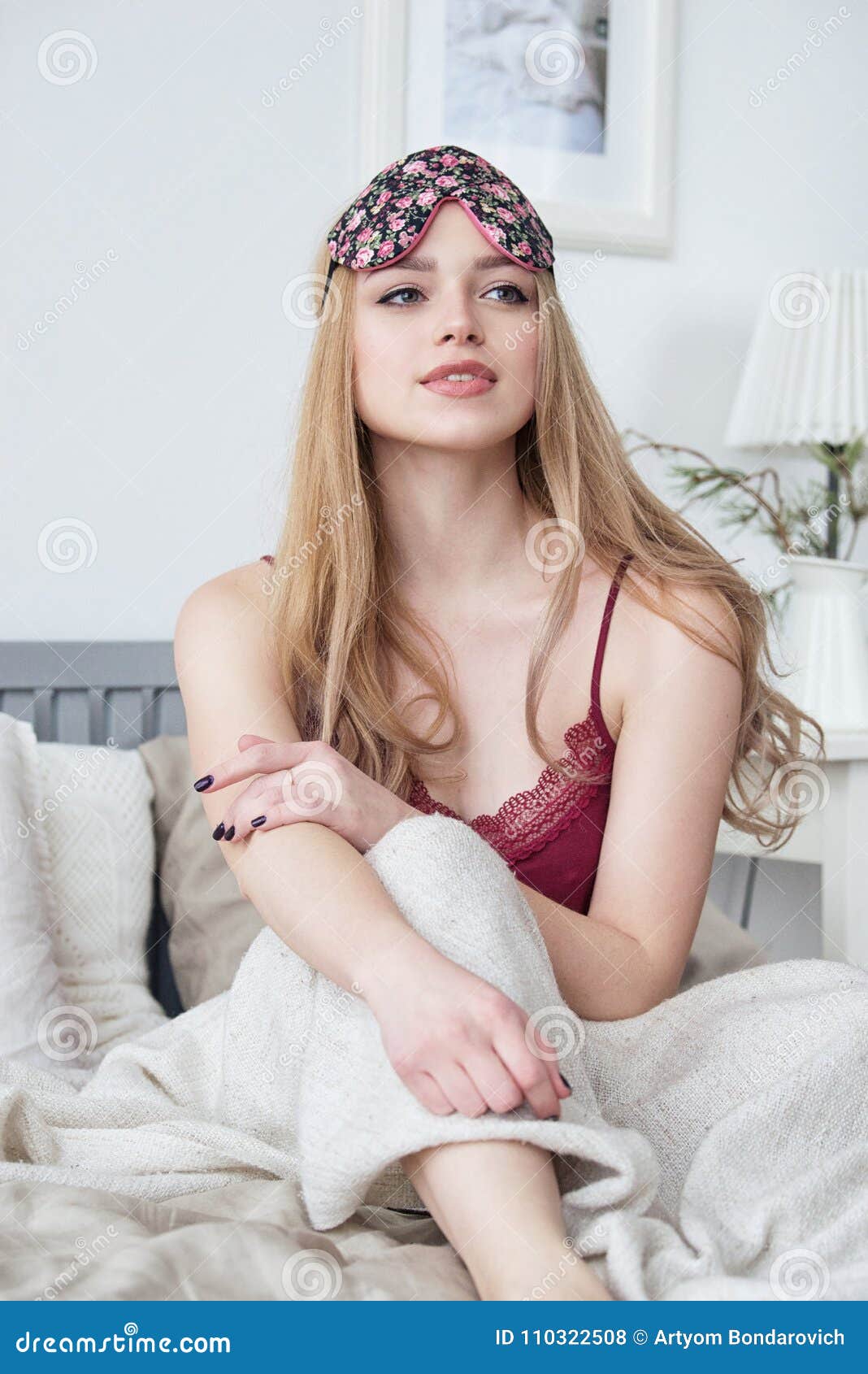 Happy Smiling Young Woman Sitting in Her Bed at Home, Wearing Nighty ... Happy Smiling Young Woman Sitting in Her Bed at Home, Wearing Nighty ...