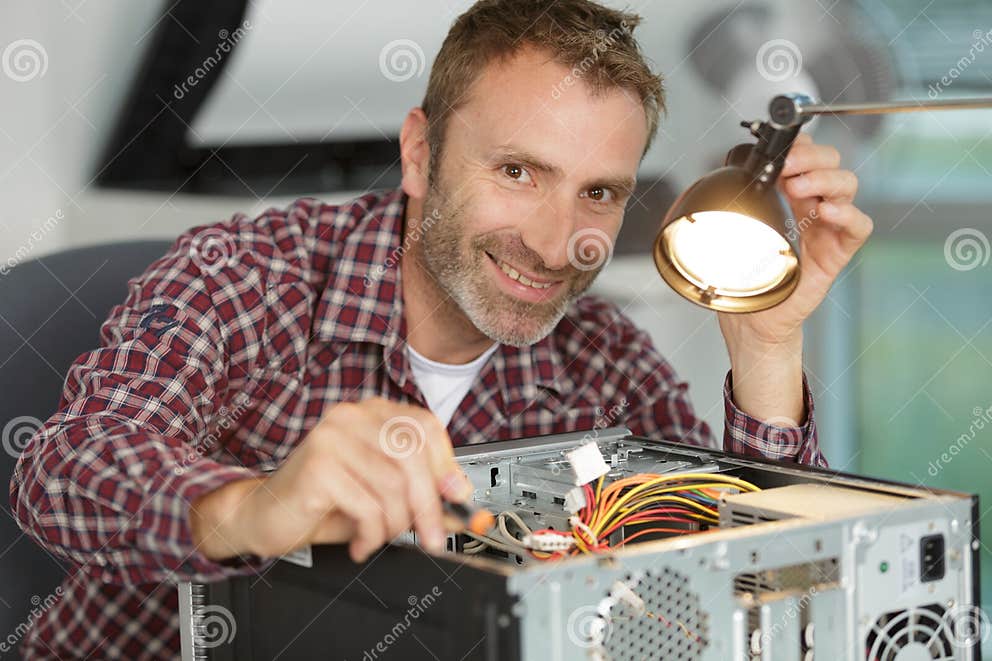 Happy and Smily Man Fixing Computer Stock Photo - Image of view ...